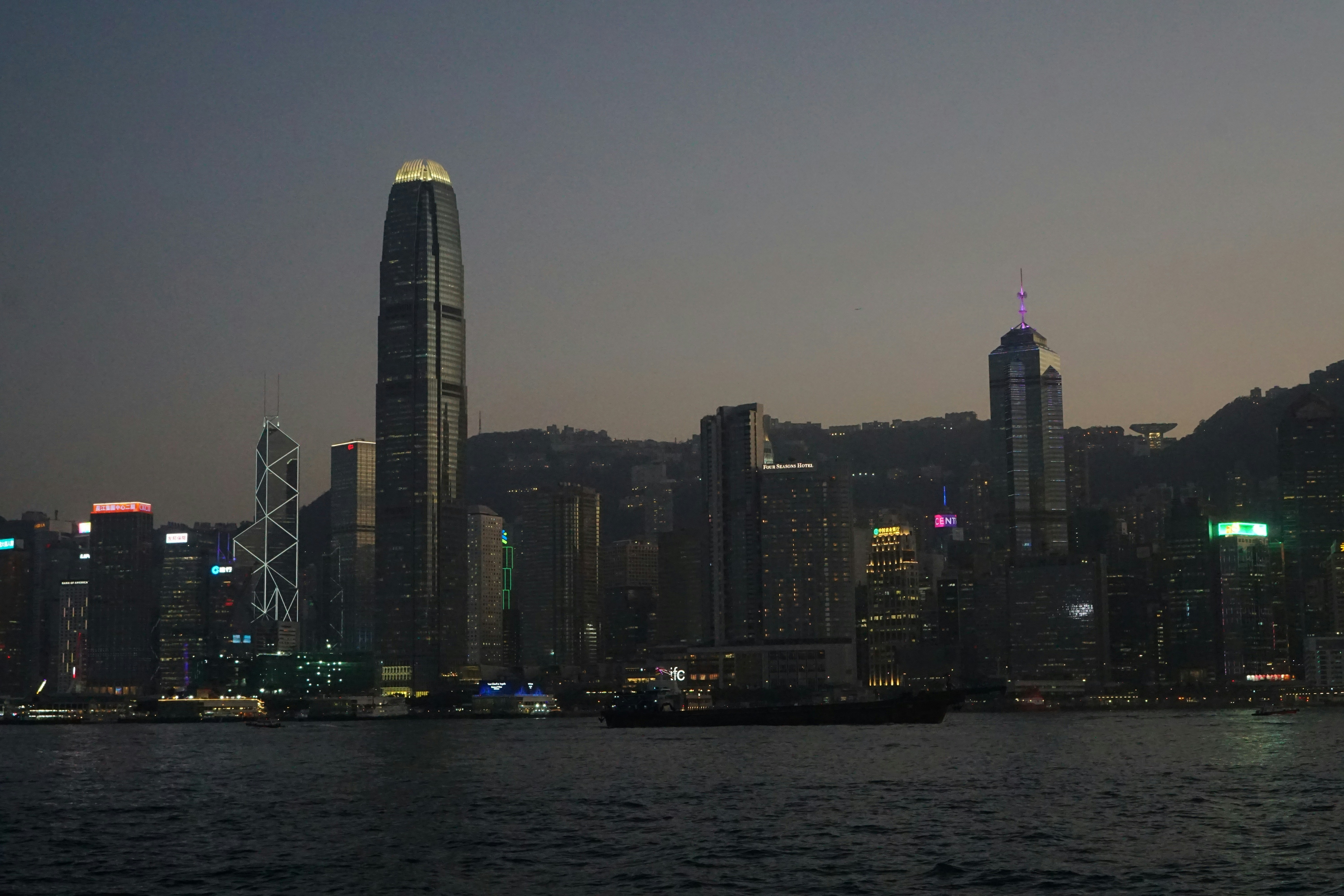 City of Glass at Dusk: Harbor Lights Over Quiet Waters