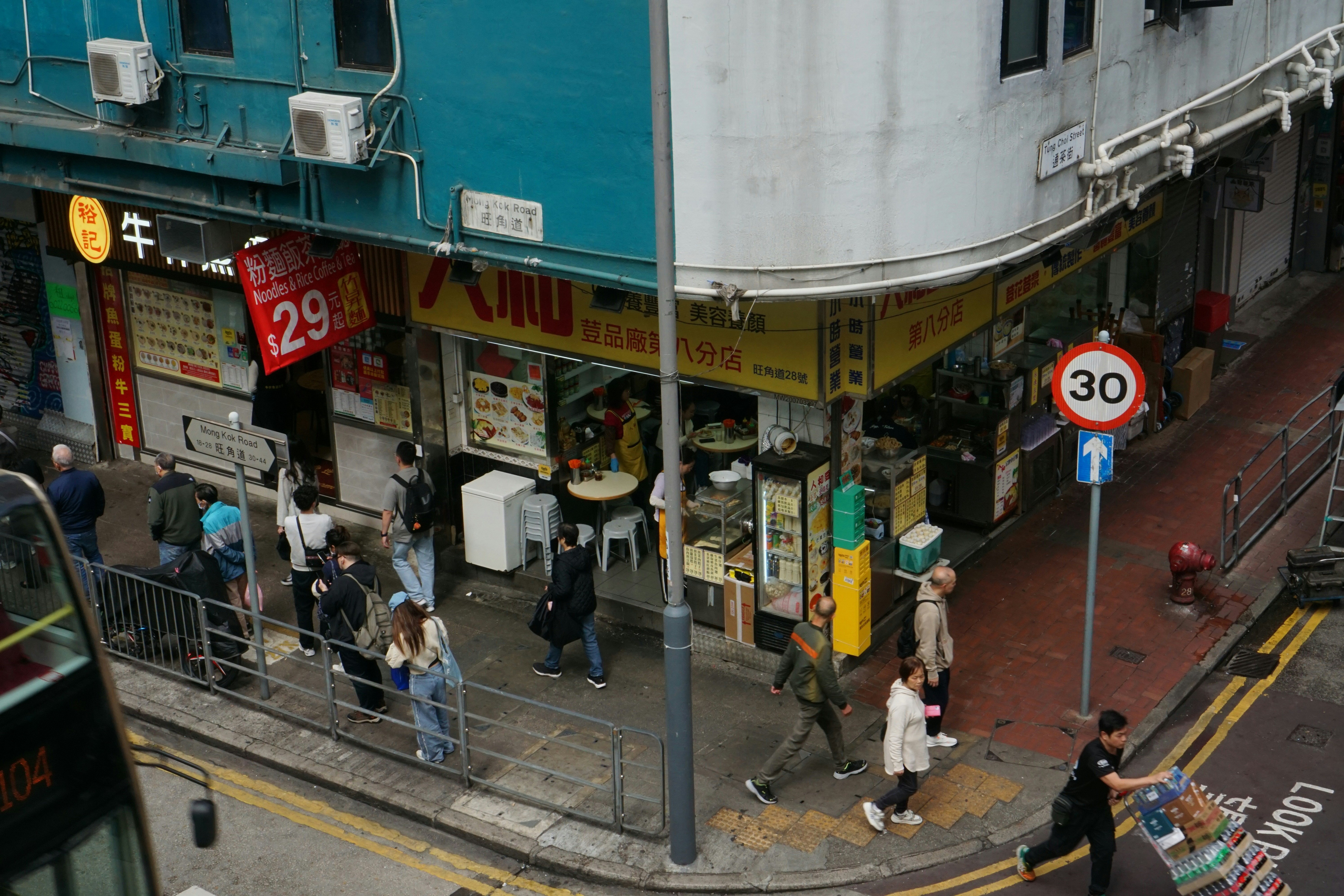 Street Corner Confluence: Shopfronts, Signs, and Pedestrians