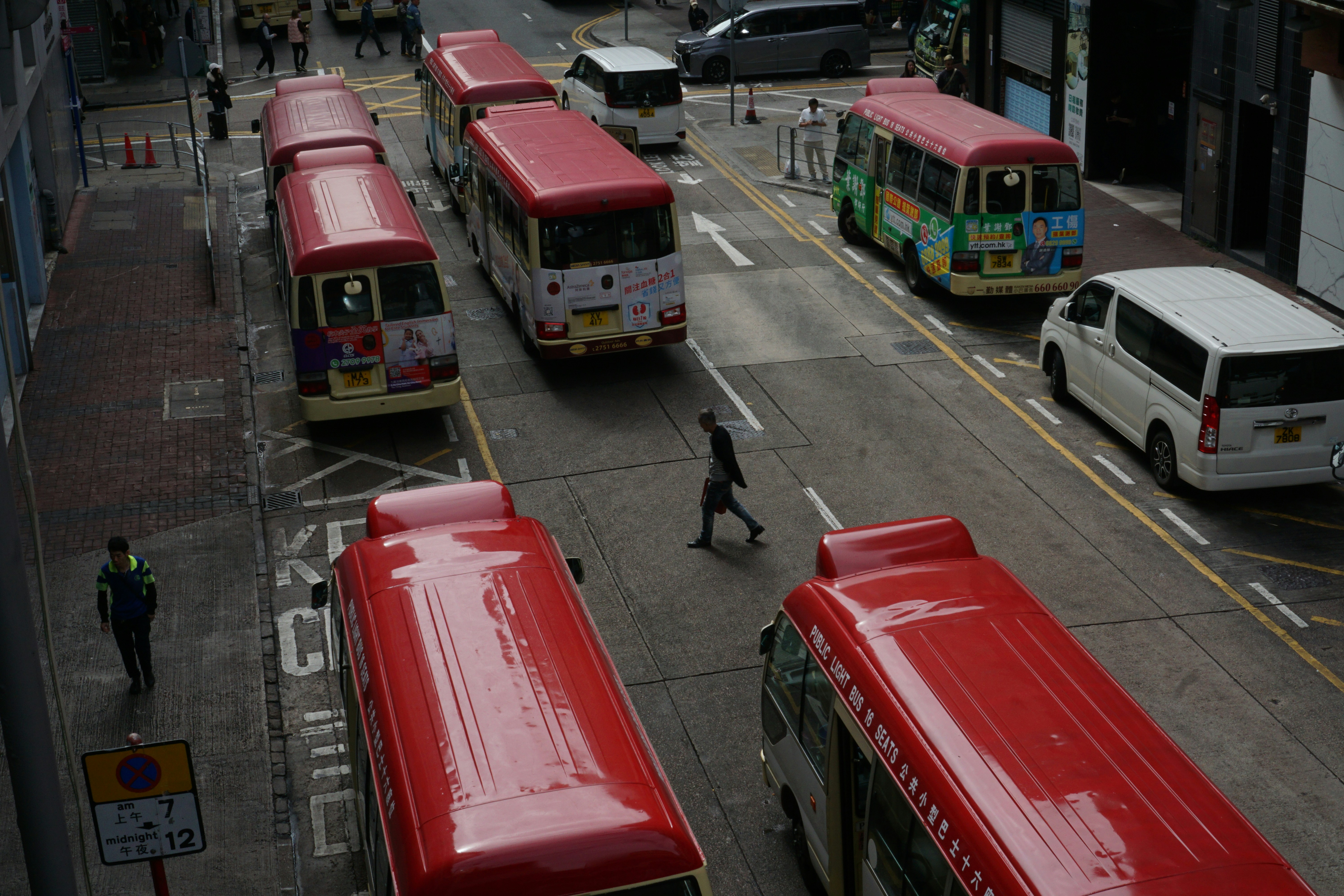 Crossroads of Red Buses: A Street-Level Moment