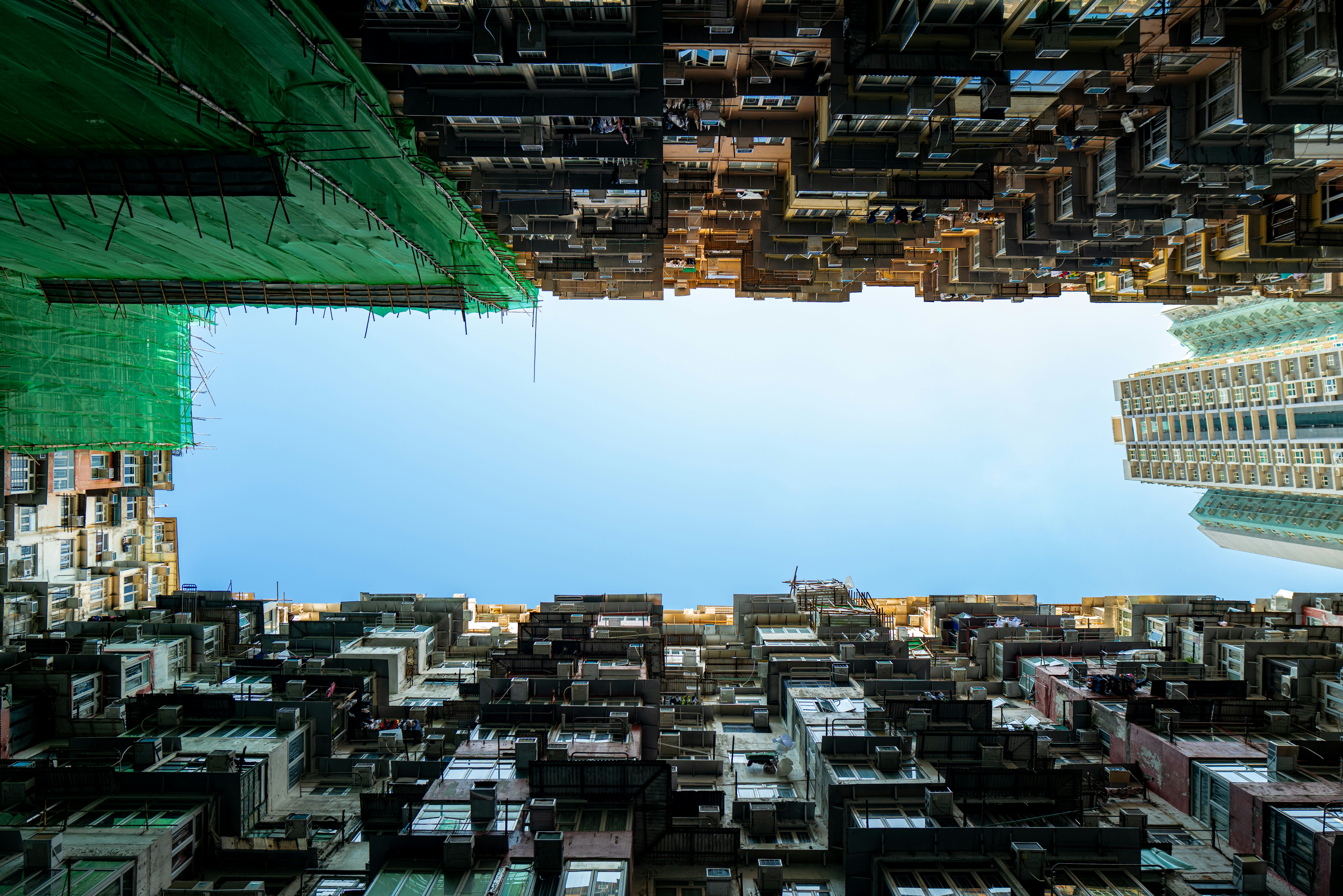 Urban Sky Gaze: A Narrow Canyon of Towers Framing the Open Sky
