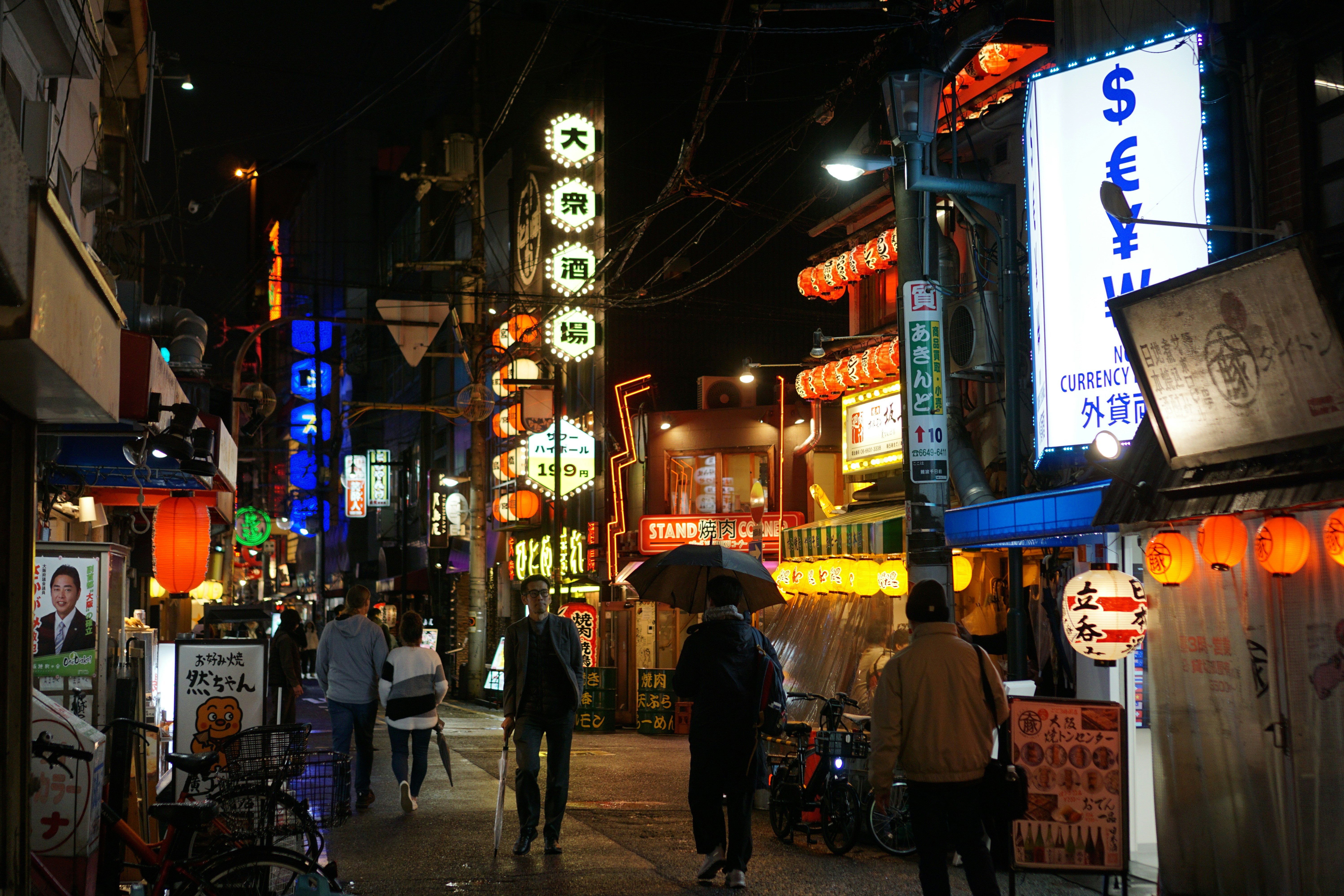 Neon Alley: Night Pedestrians Under City Lights