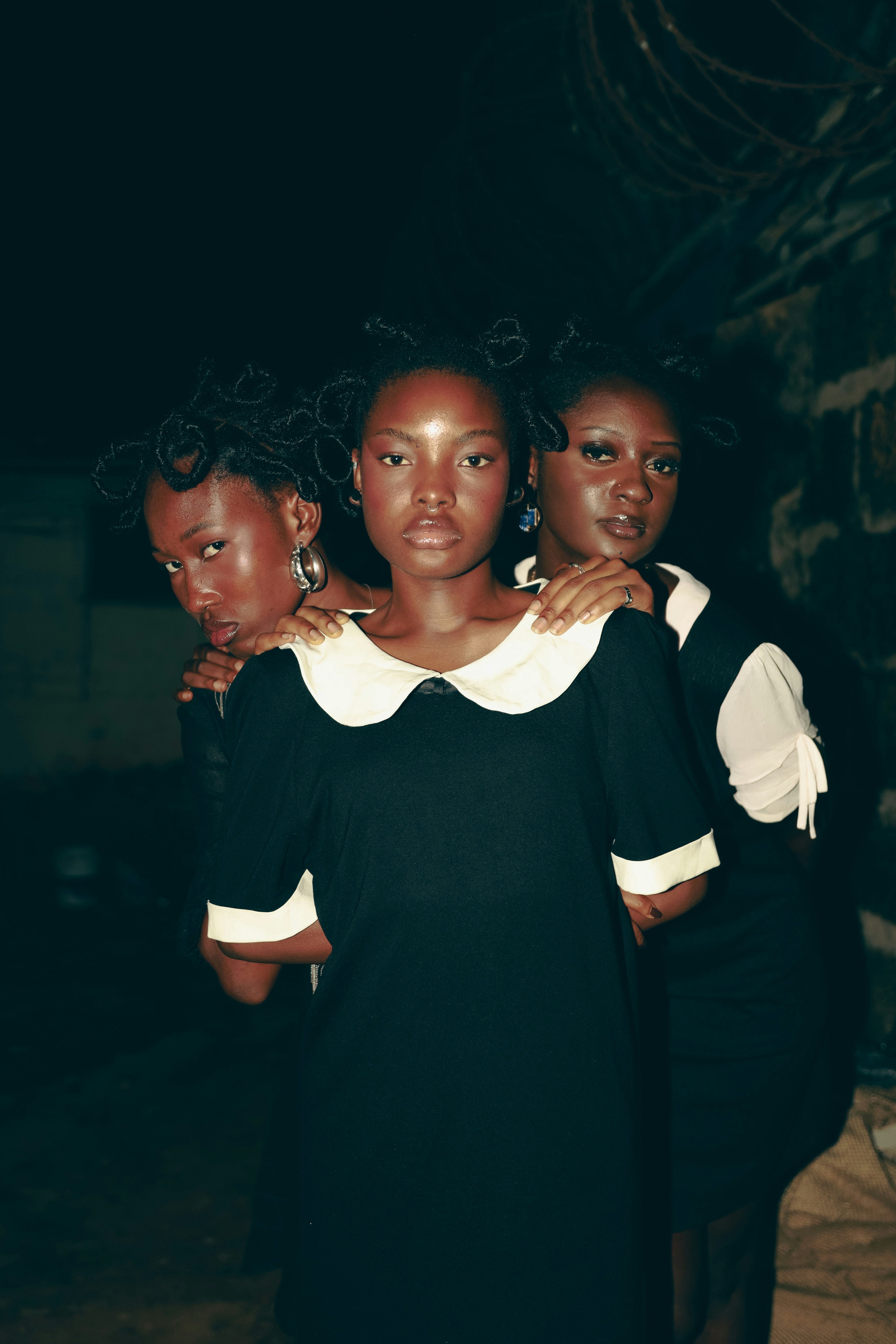 Three Portraits in Shadow: Sisterhood under Nightfall Lights