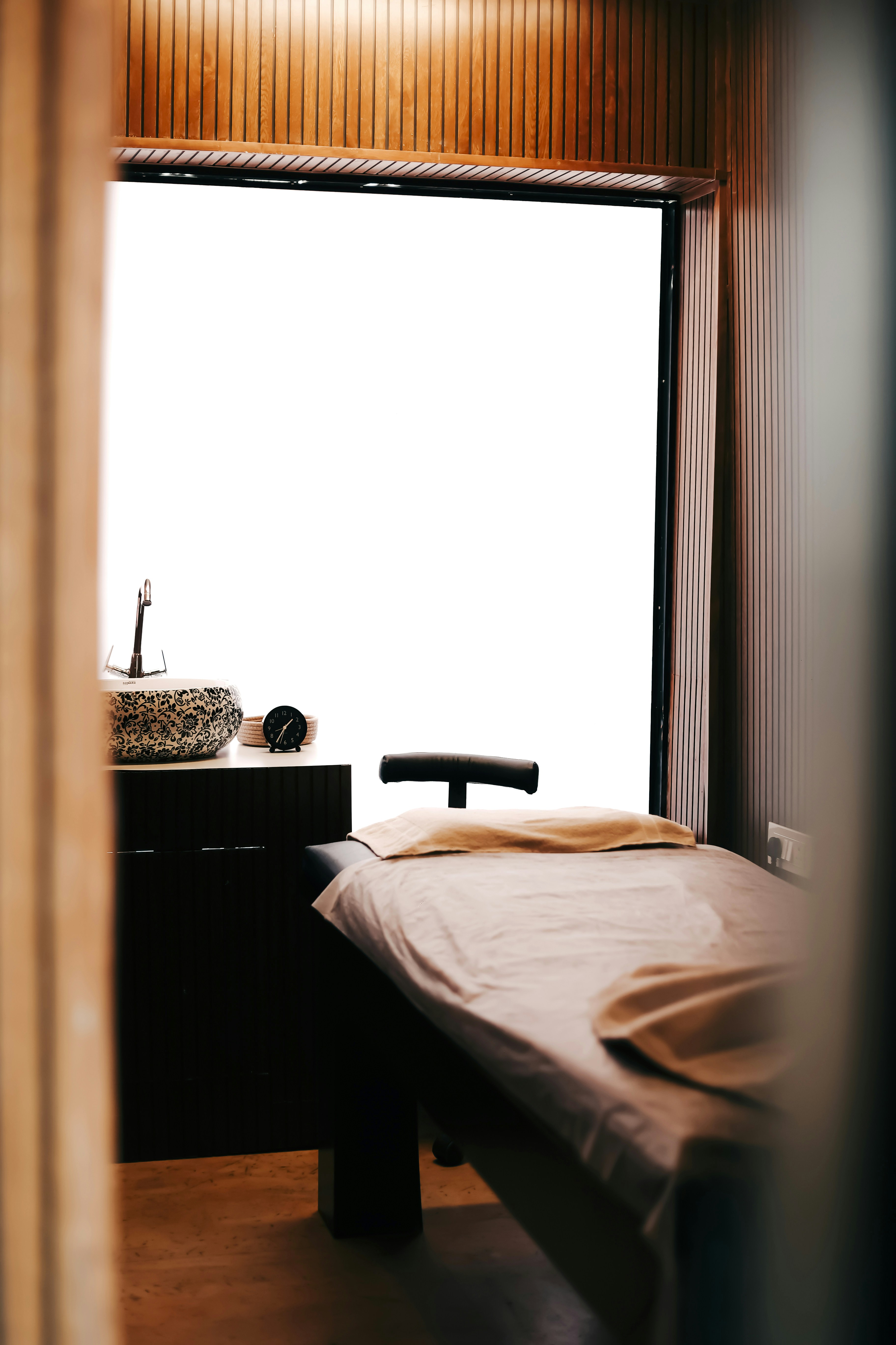Minimal Spa-like Treatment Room with Window Backdrop