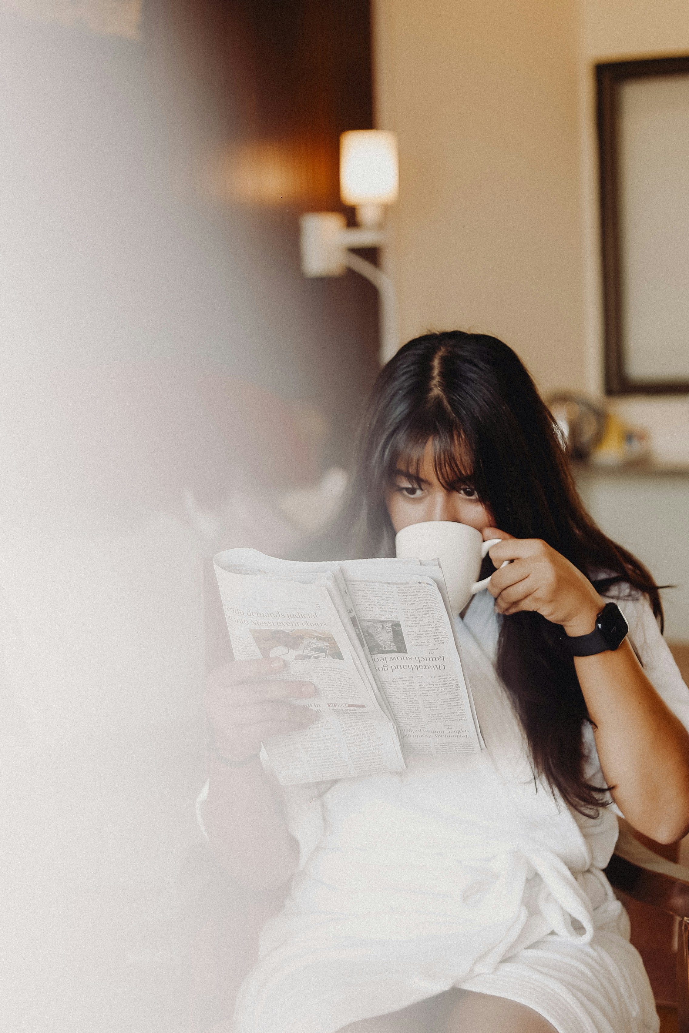 A Quiet Morning Read: Steam, Cup, and a Newspaper