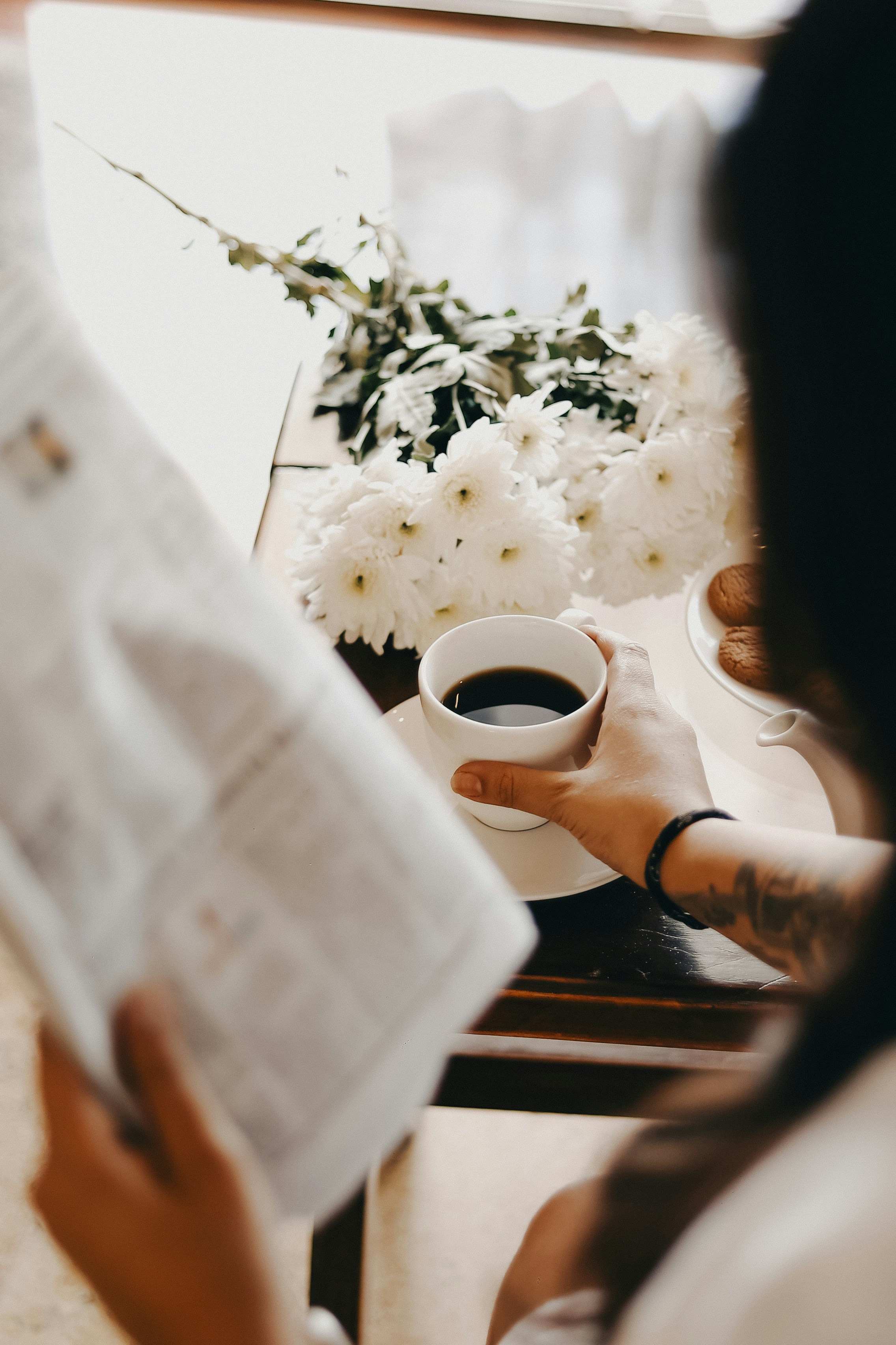Coffee and Confetti: A Quiet Moment by the Floral Clock