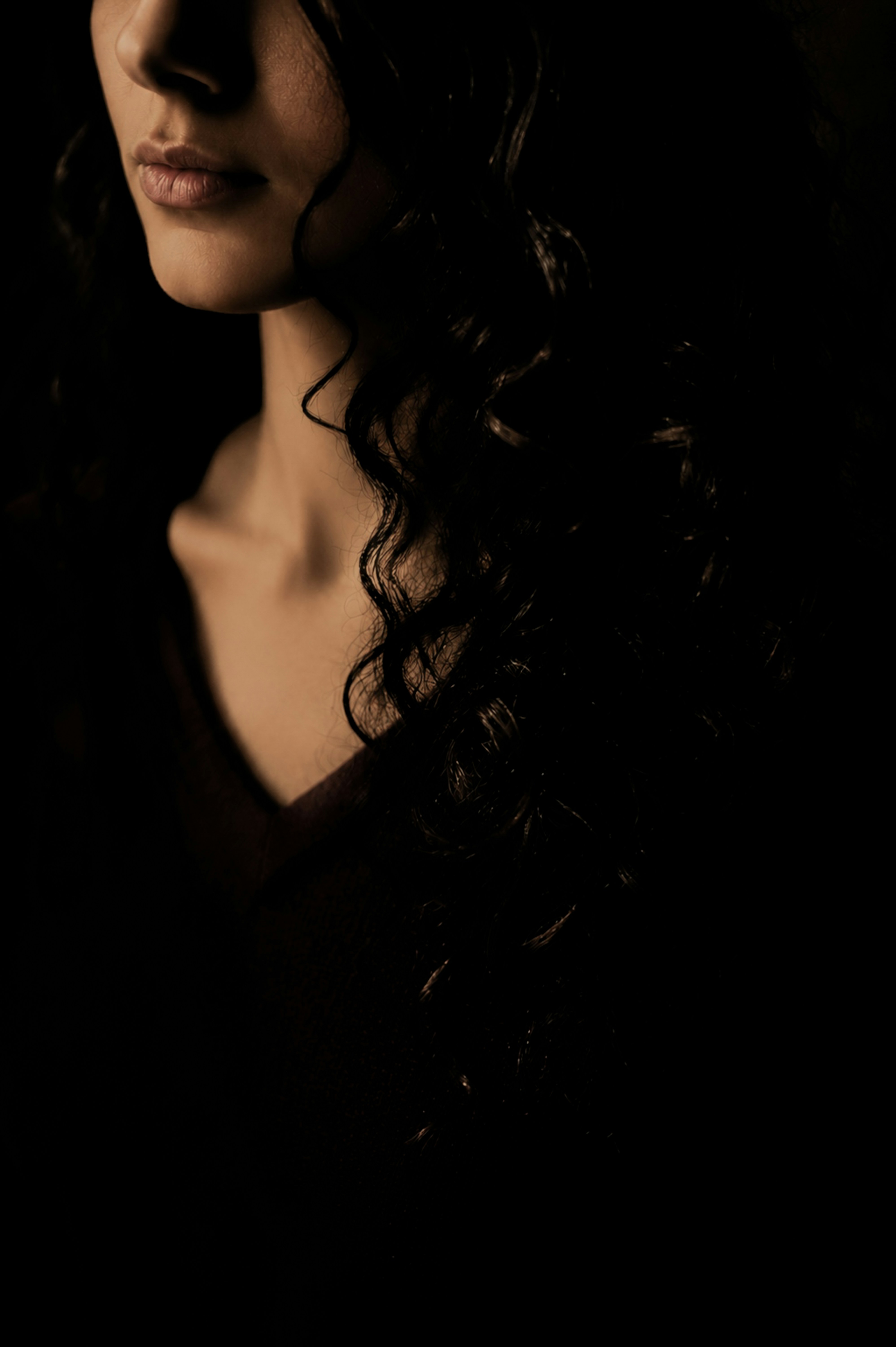Shadowed Portrait: A Gentle Side Profile in Warm Minimal Light