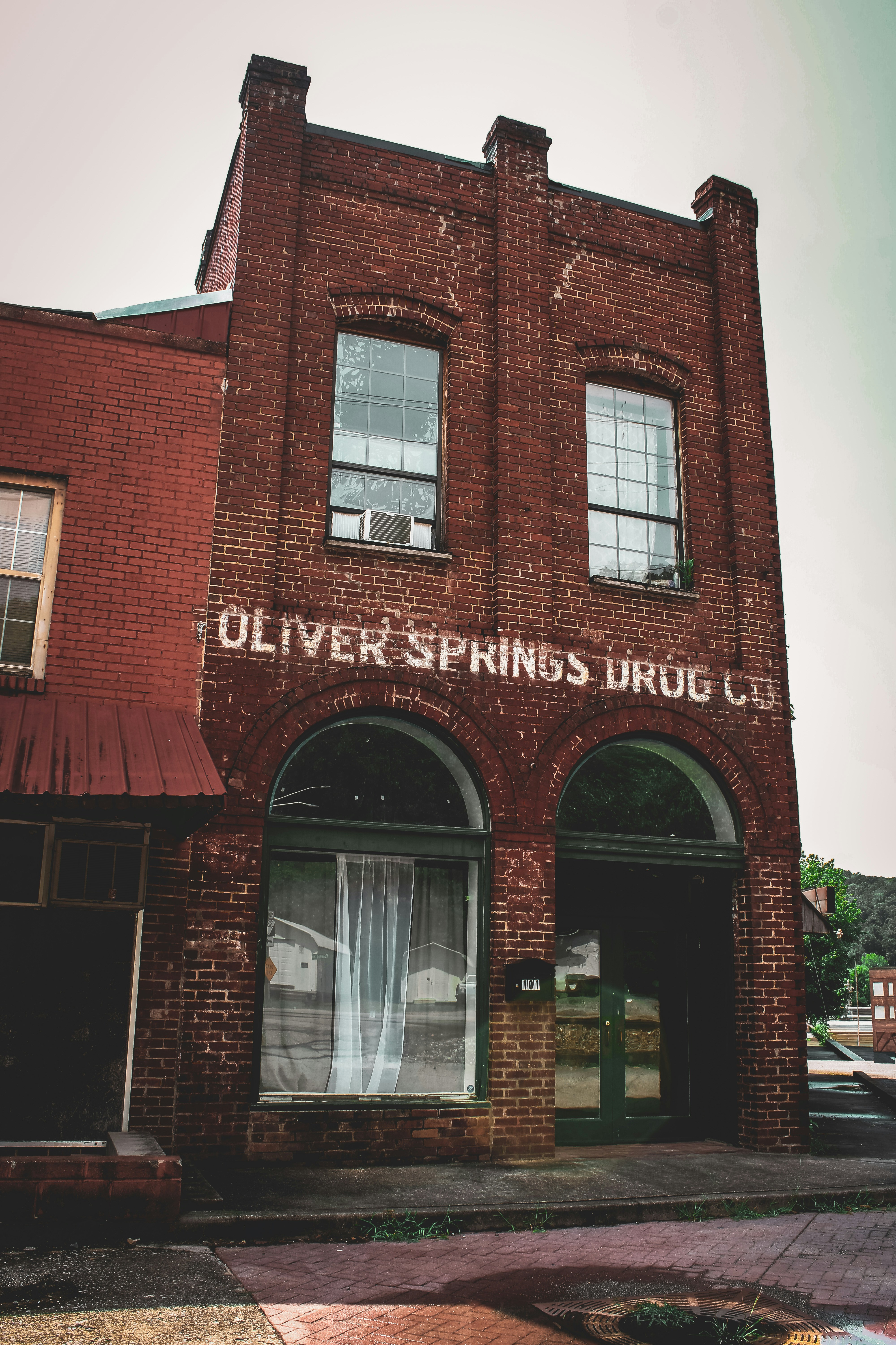 Brick Facade Revival: Oliver Springs Drug Co. Facade Within a Quiet Main Street