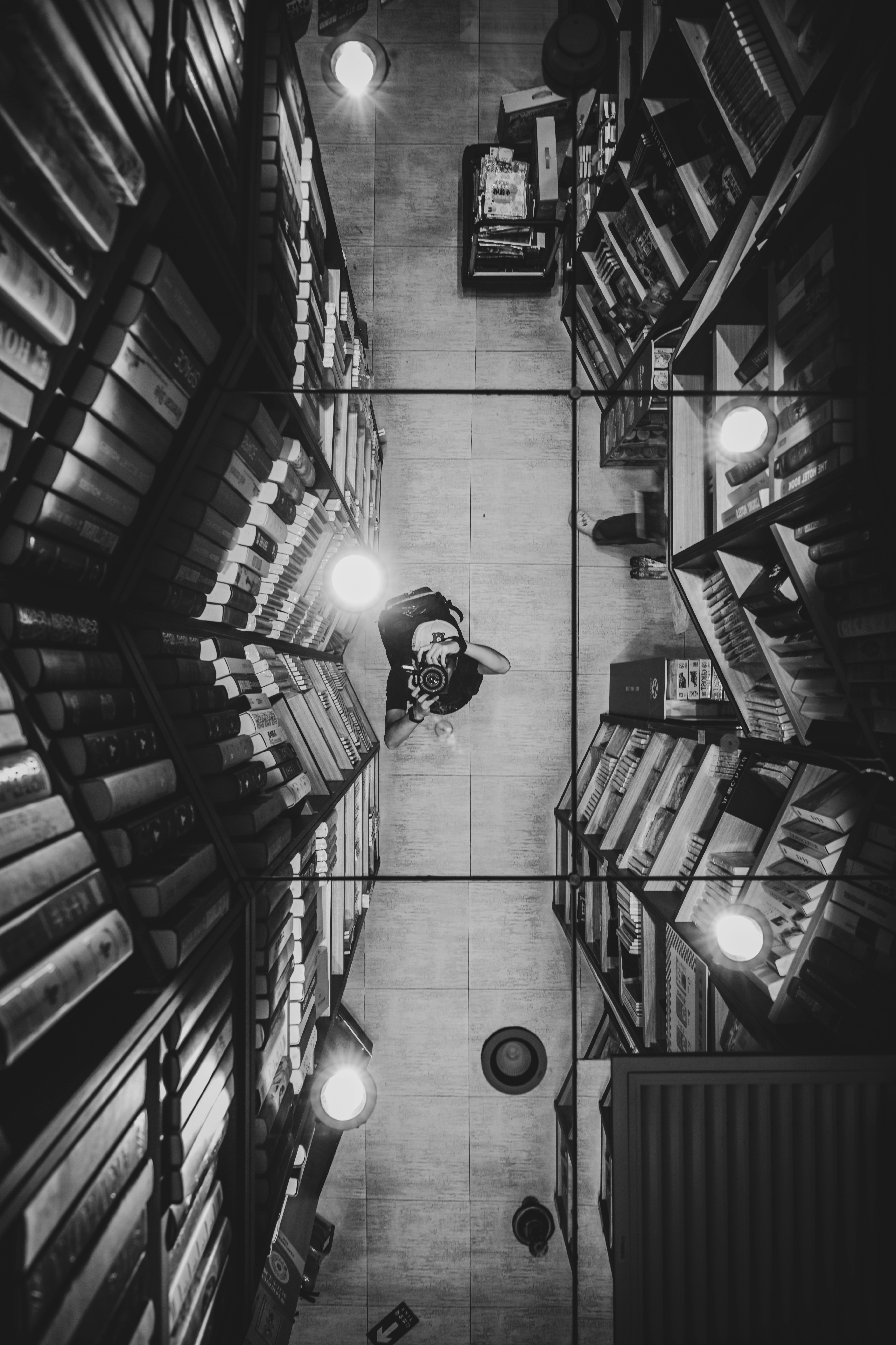 Aisle of Quiet Study: Overhead in a Black-and-White Library