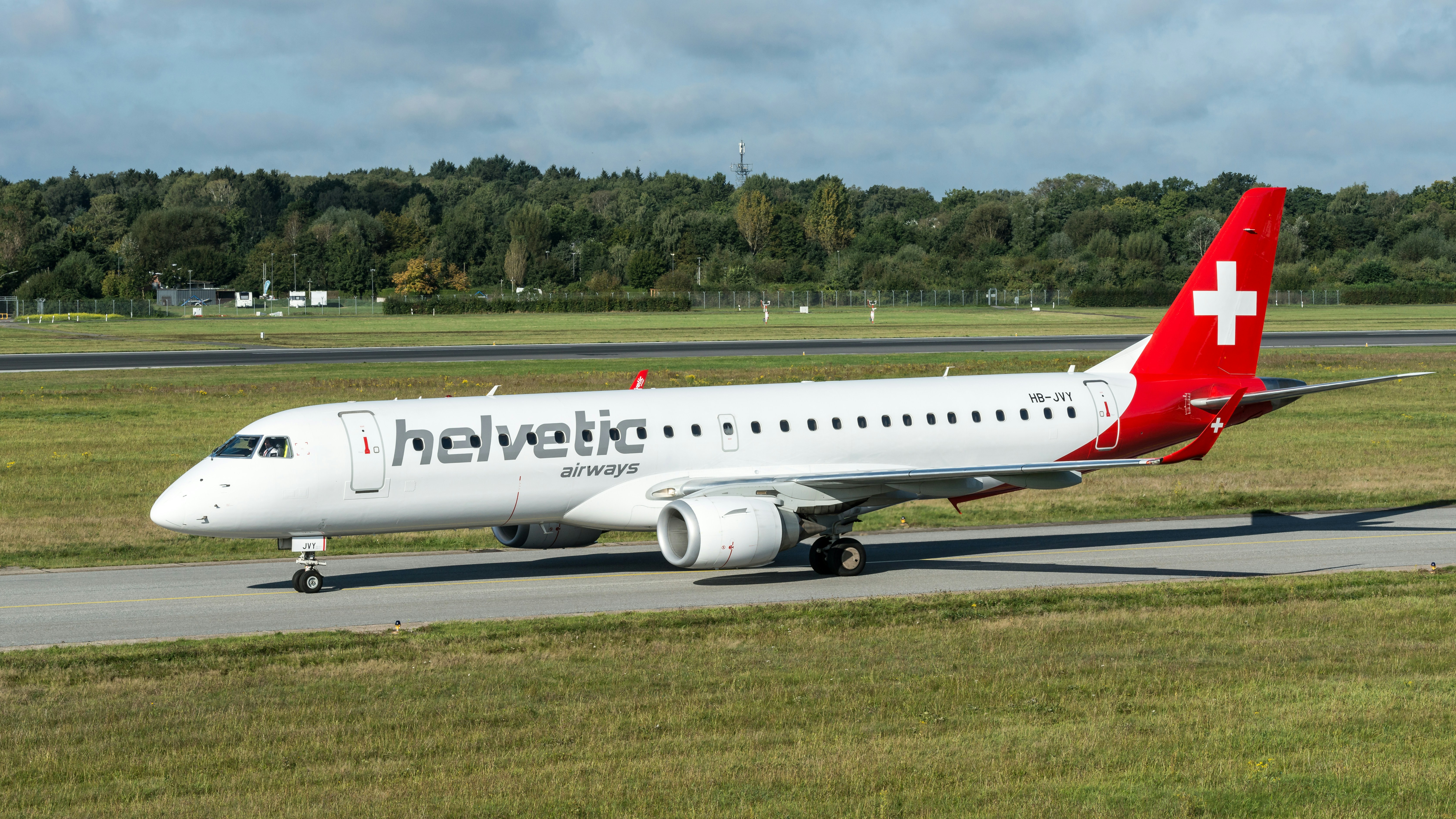 Swiss Pride taxiing: a Helvetic Airbus glides along the runway