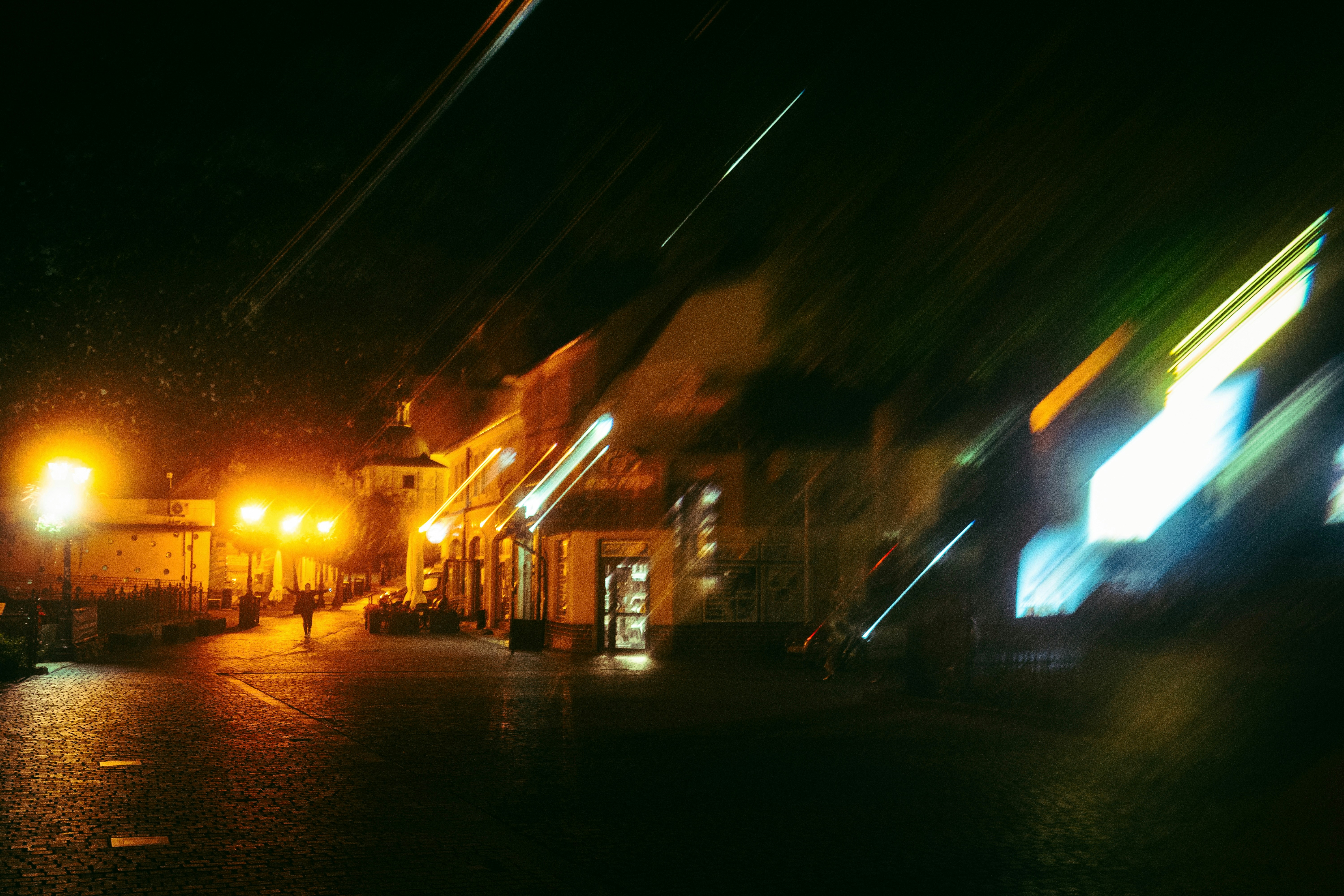 Night Street Streaks: A Blurred Quiet with Neon Echoes