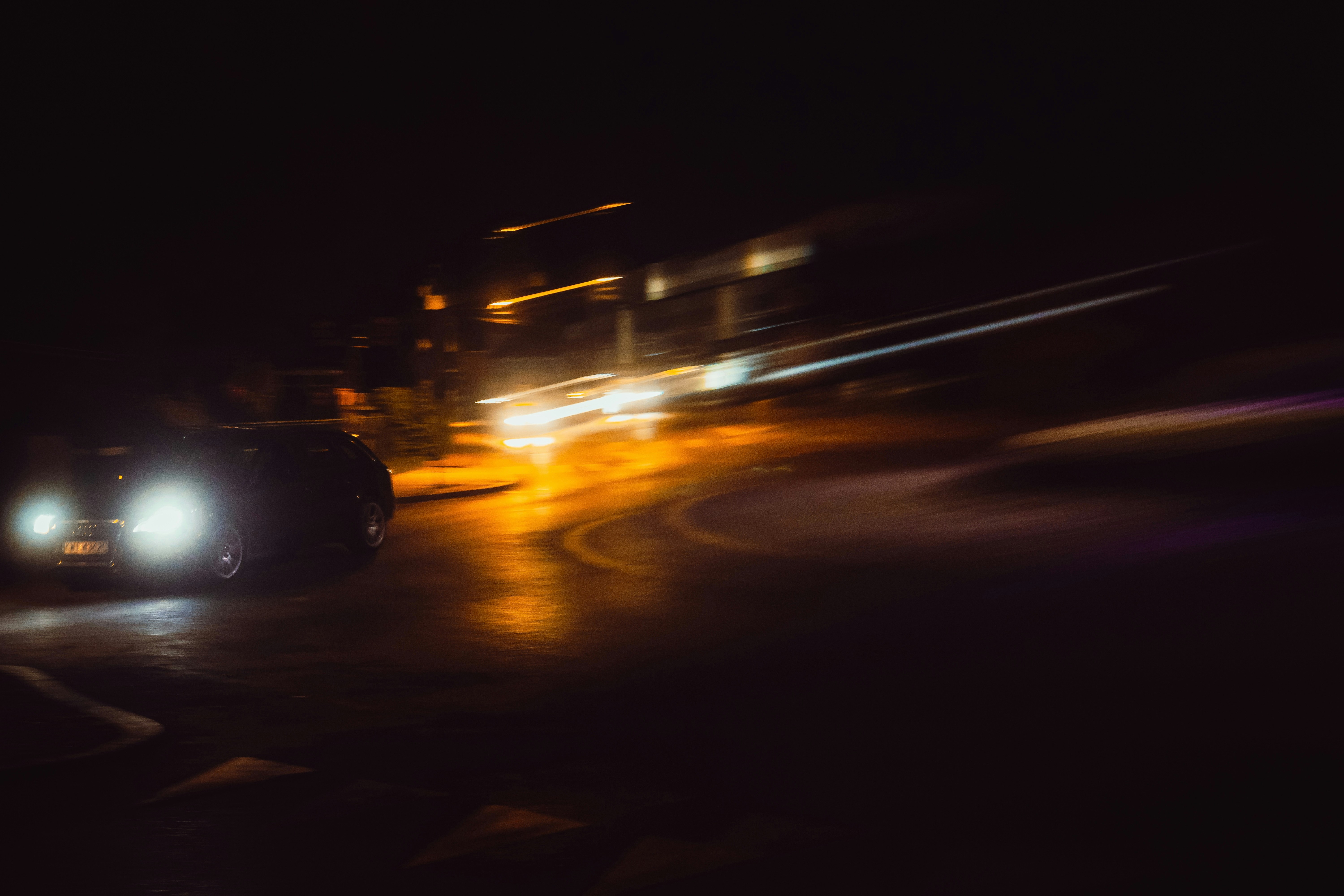 Night Drift: A Glowing Car Slice Across the Street