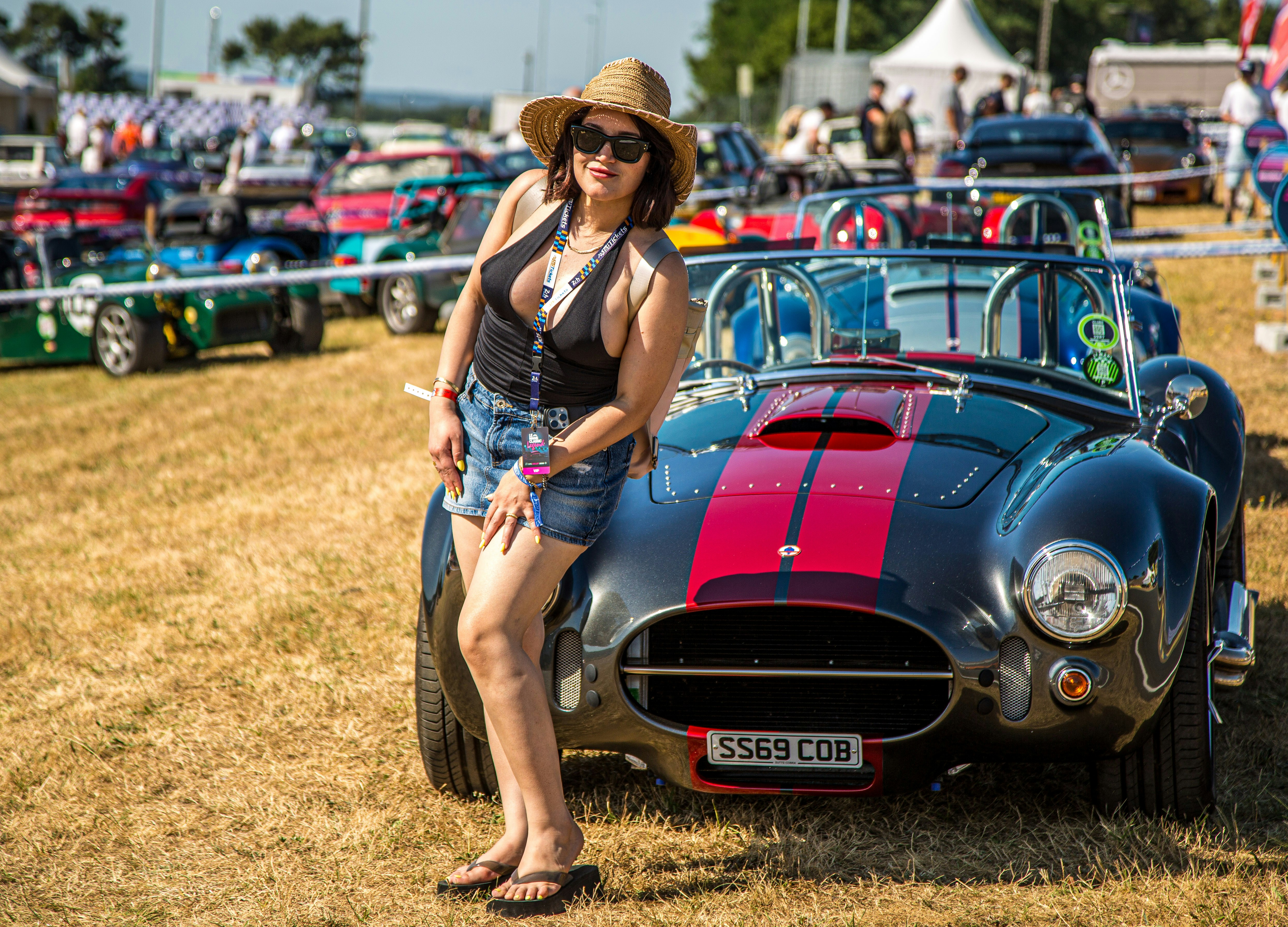 Sunlit Spectacle: A Convertible Classic and a Style‑Tapped Stranger