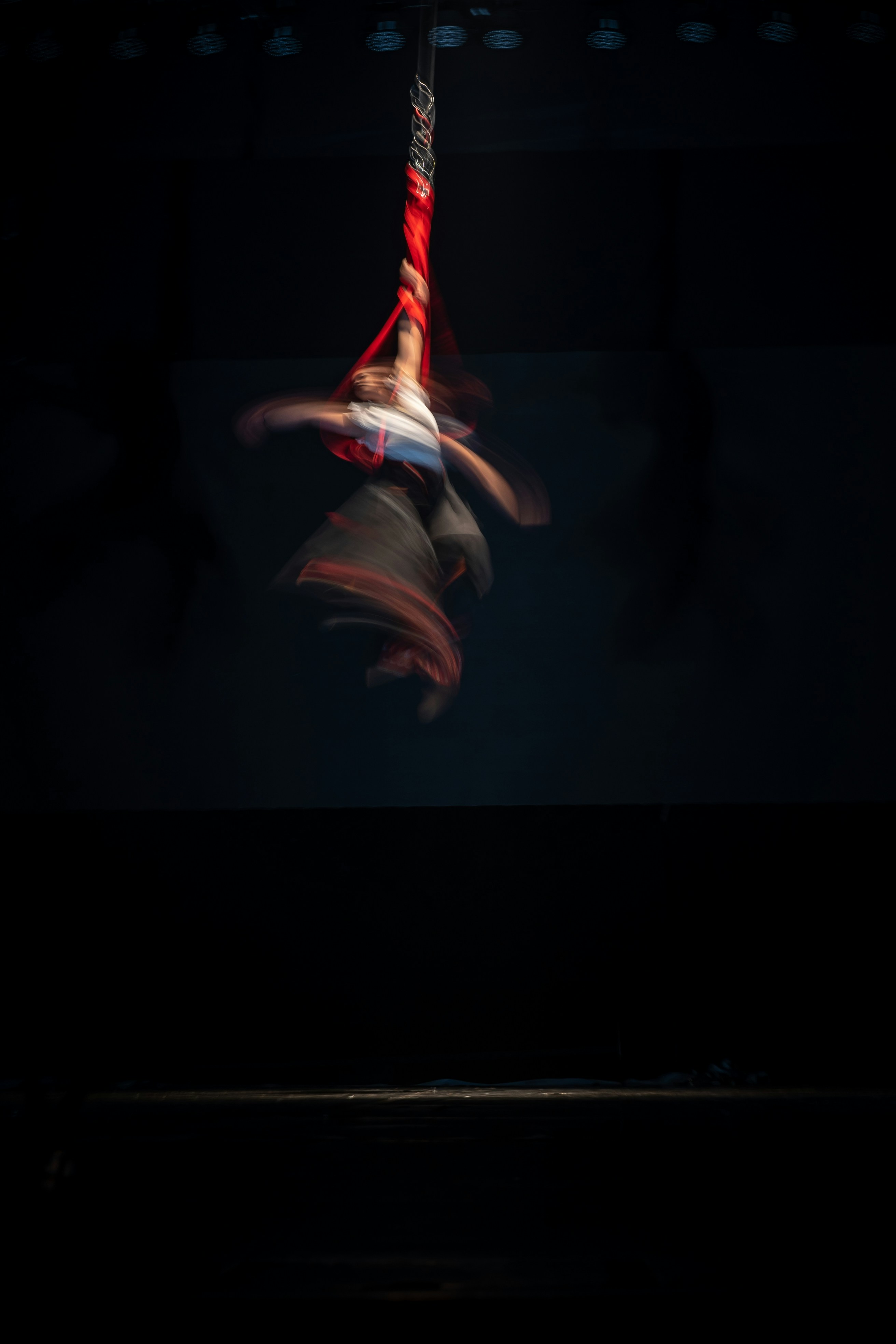 Red Silk Descent: Aerial Aerialist in Motion