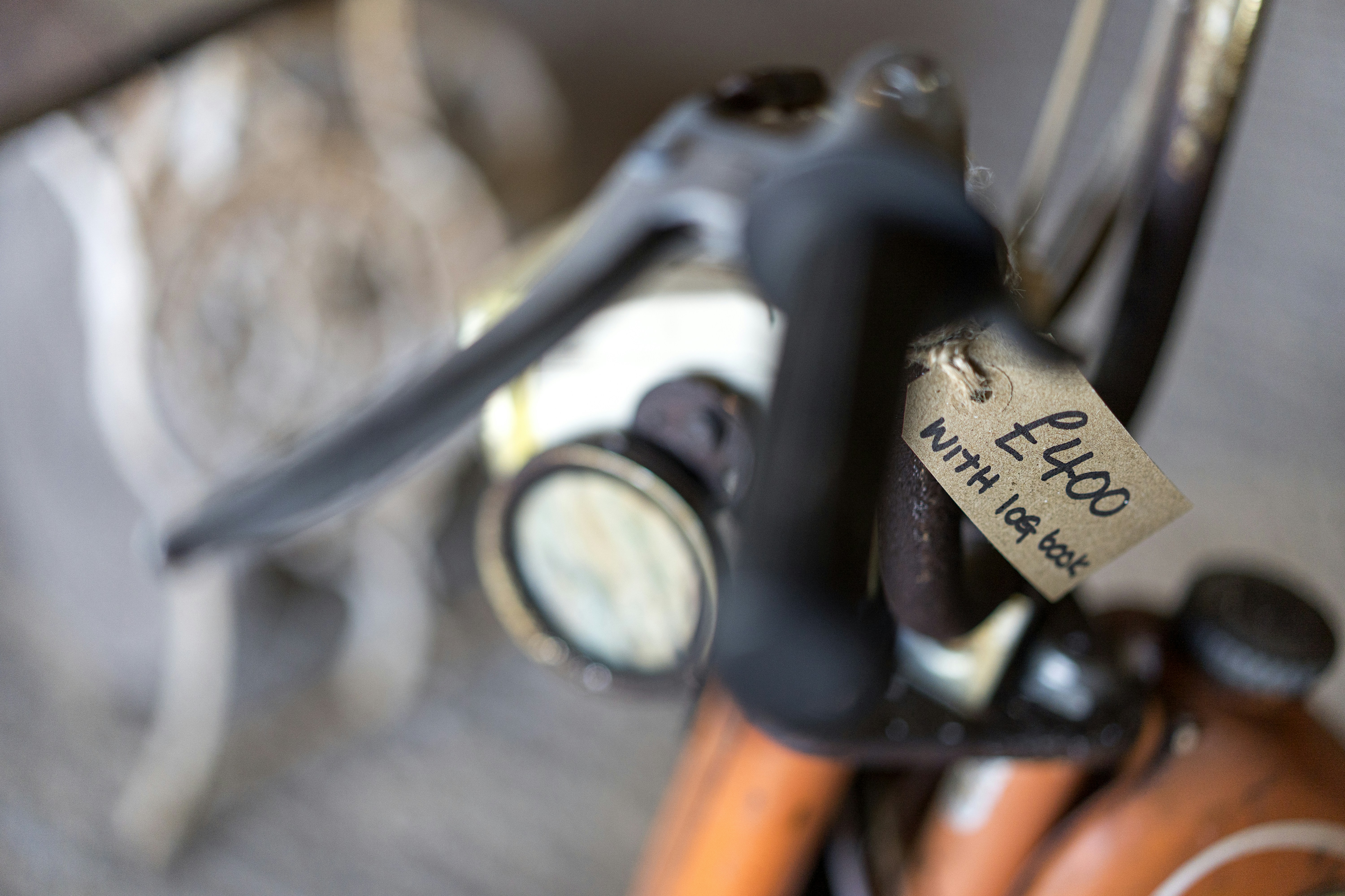 Close-Up of a Vintage Bicycle Handlebar with a Shabby Tag