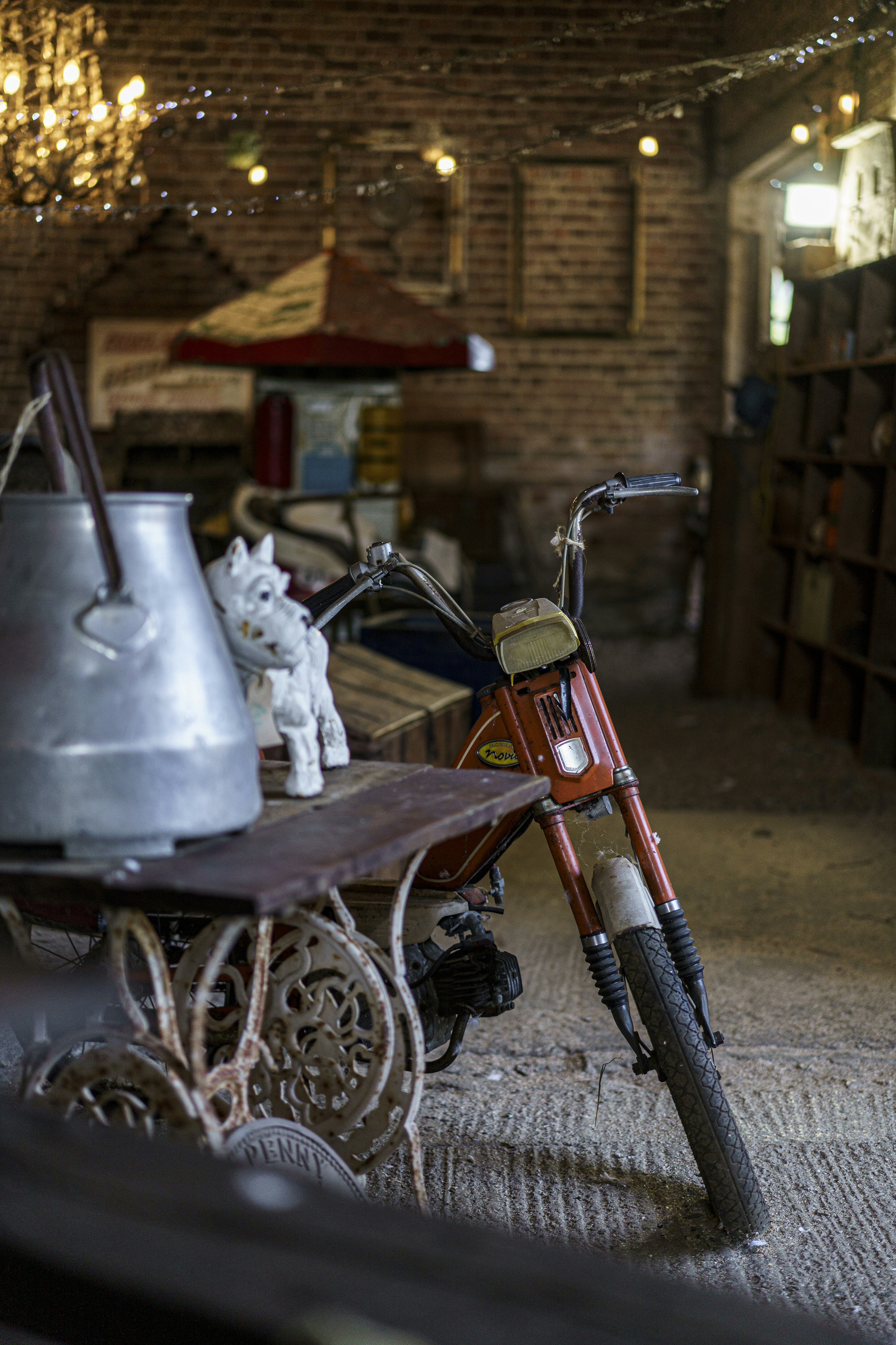 Old Red Bike and Milk Can in a Dim Workshop