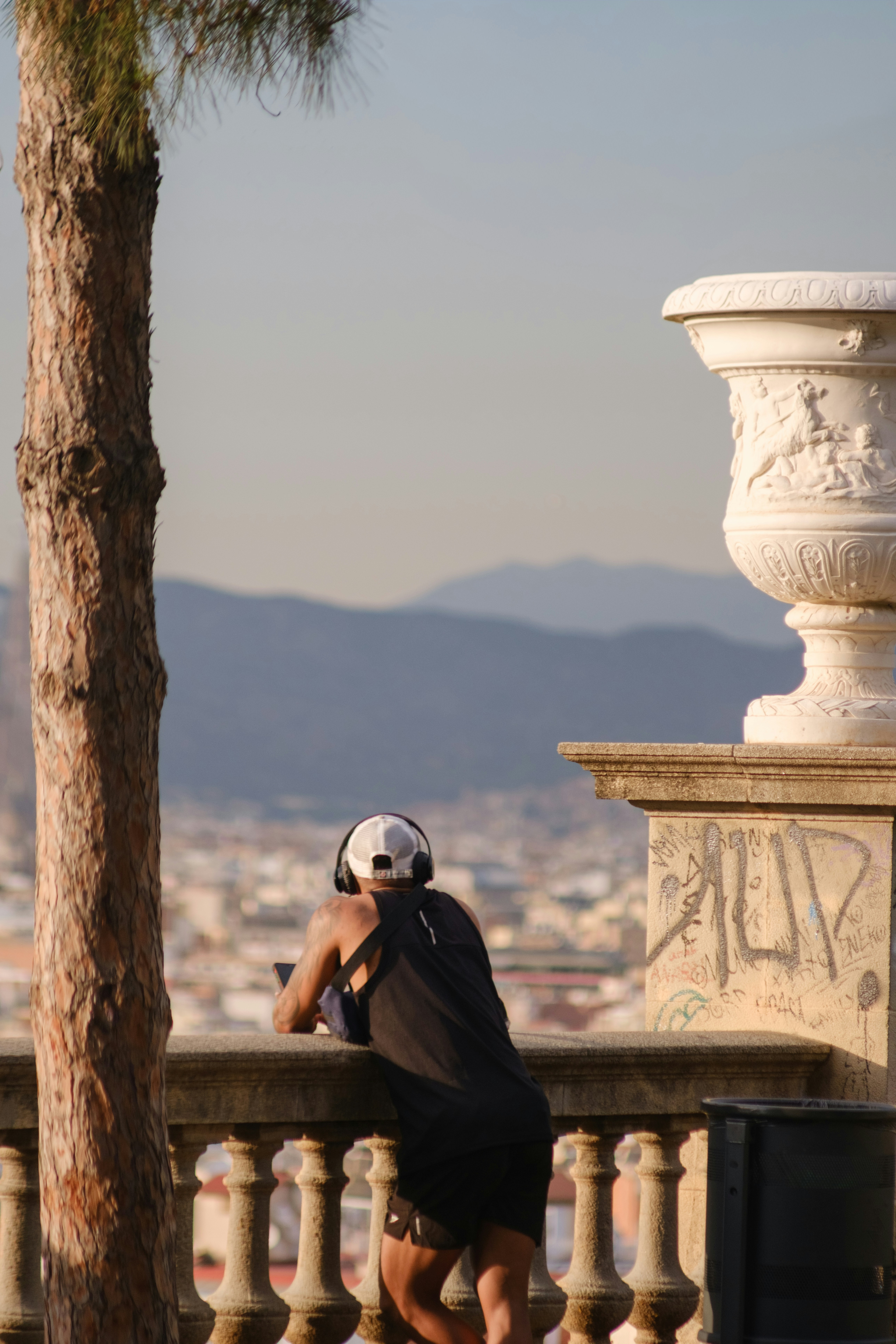 Onlook and Sunset Rail: A Traveler Peers Over the Terrace