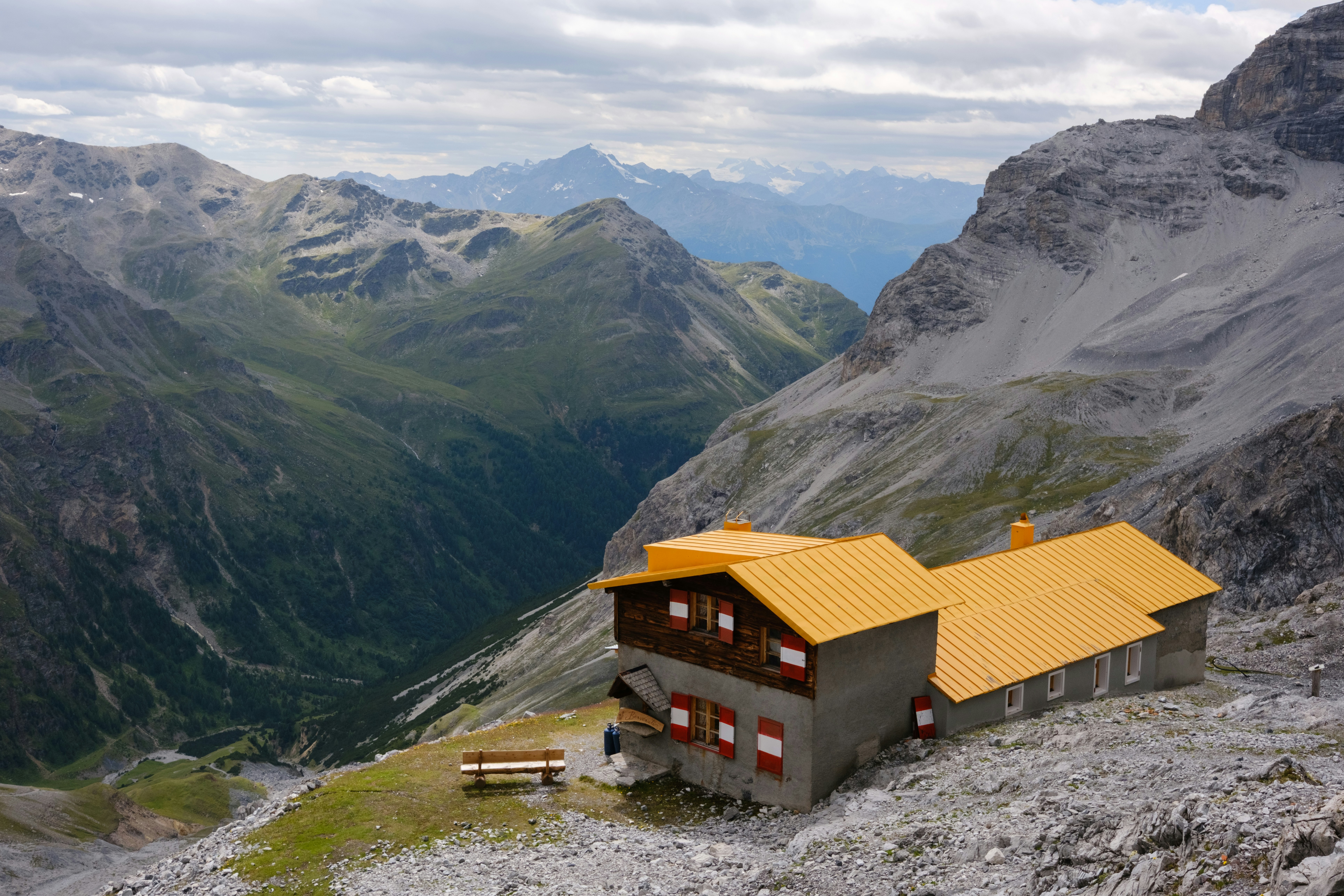 Clifftop Alpine Refuge with Golden Roofs