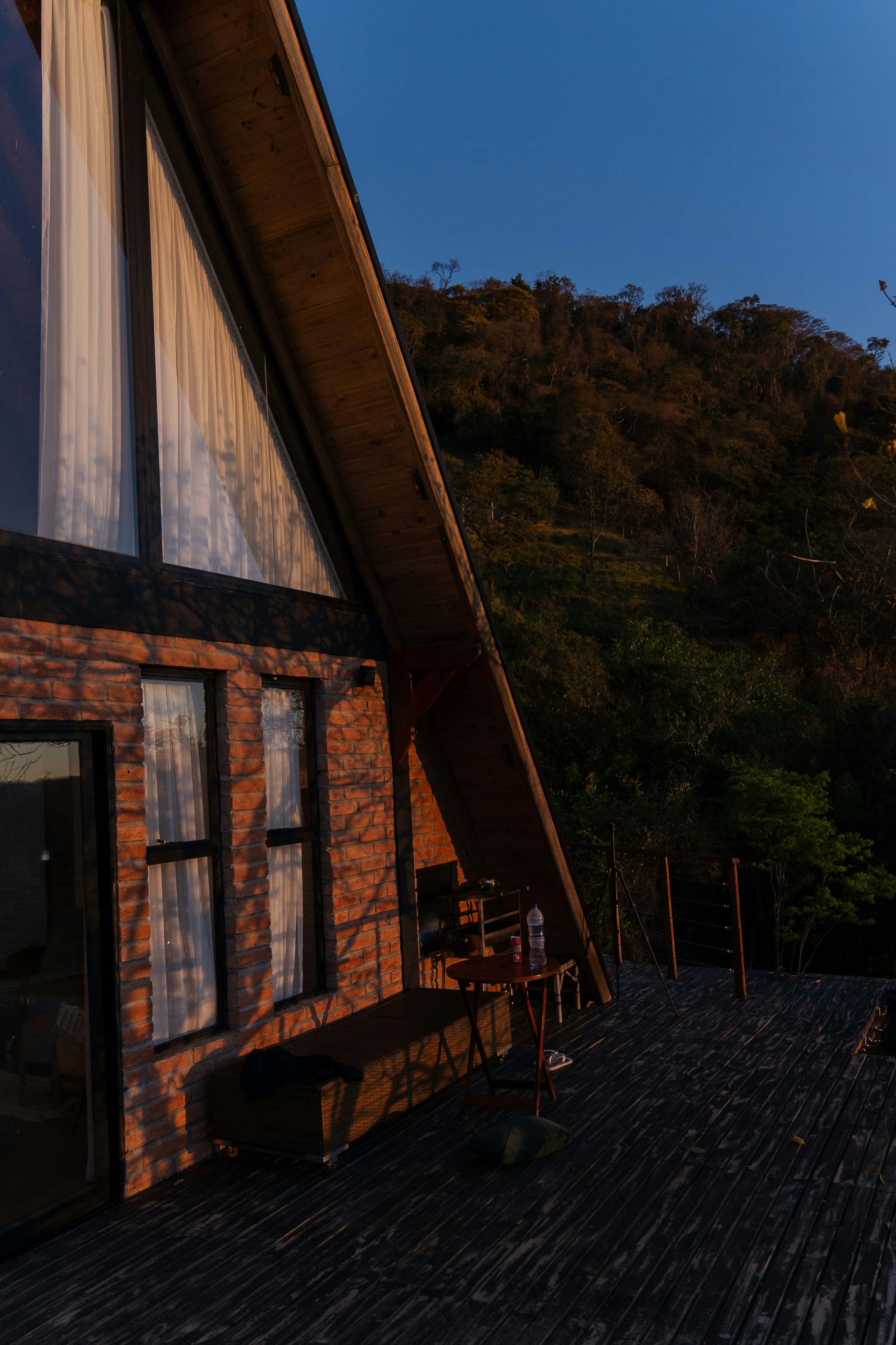 A Quiet Terrace at Dusk on a Sloped A-frame Home