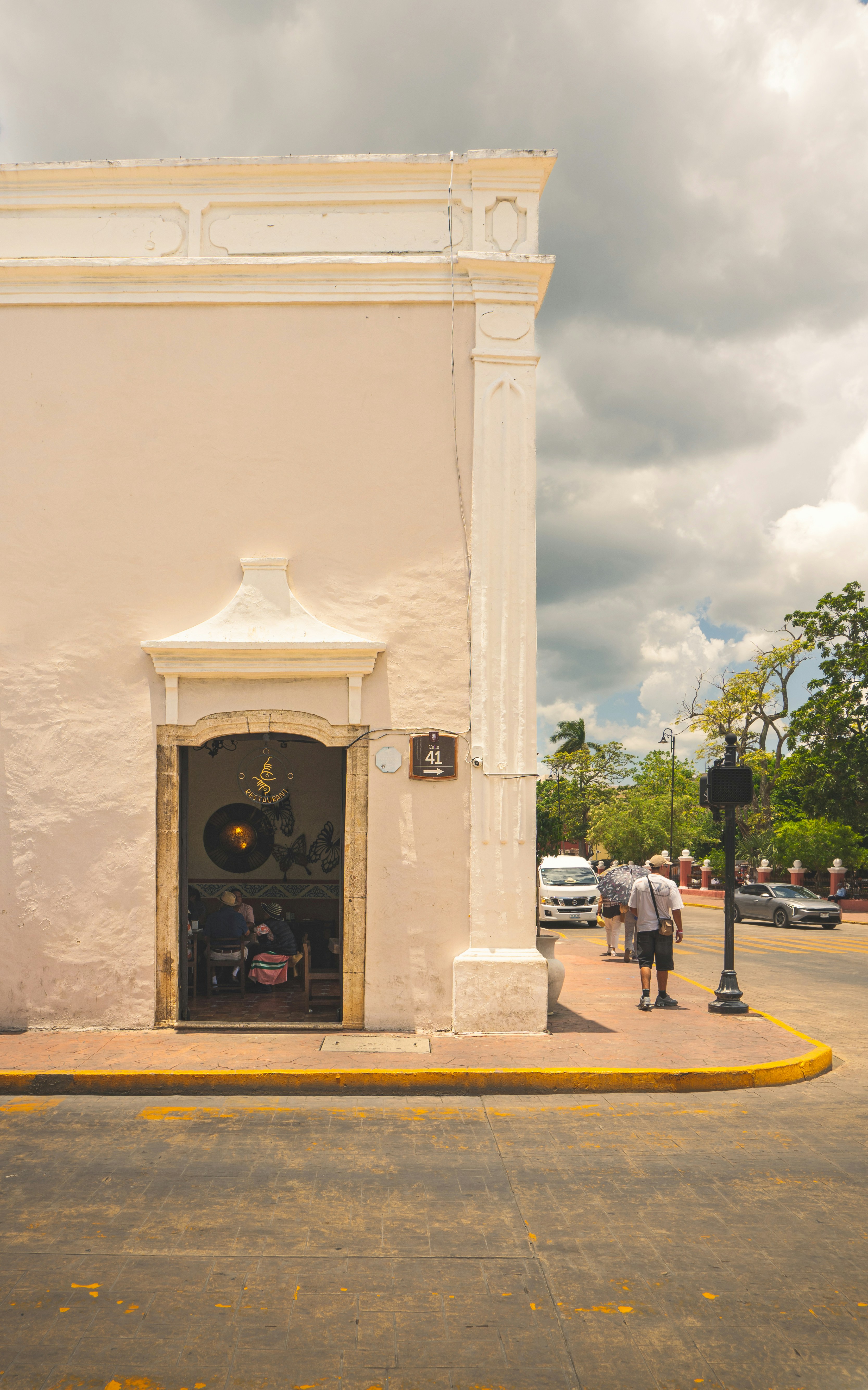 Pastel Corner: Sunlit Arcade at a Quiet Plaza