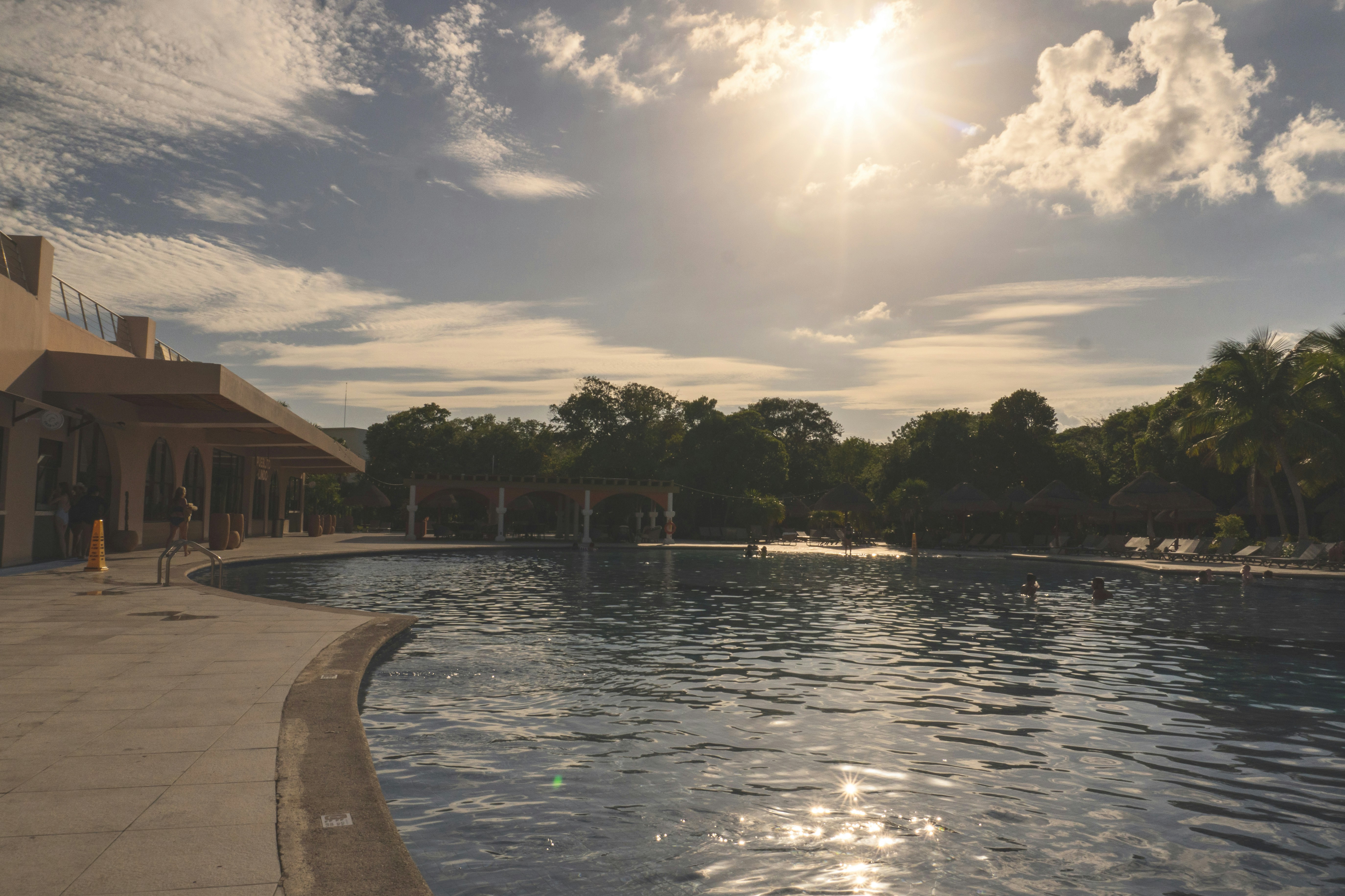 Sunlit Poolside Serenade at Dusk