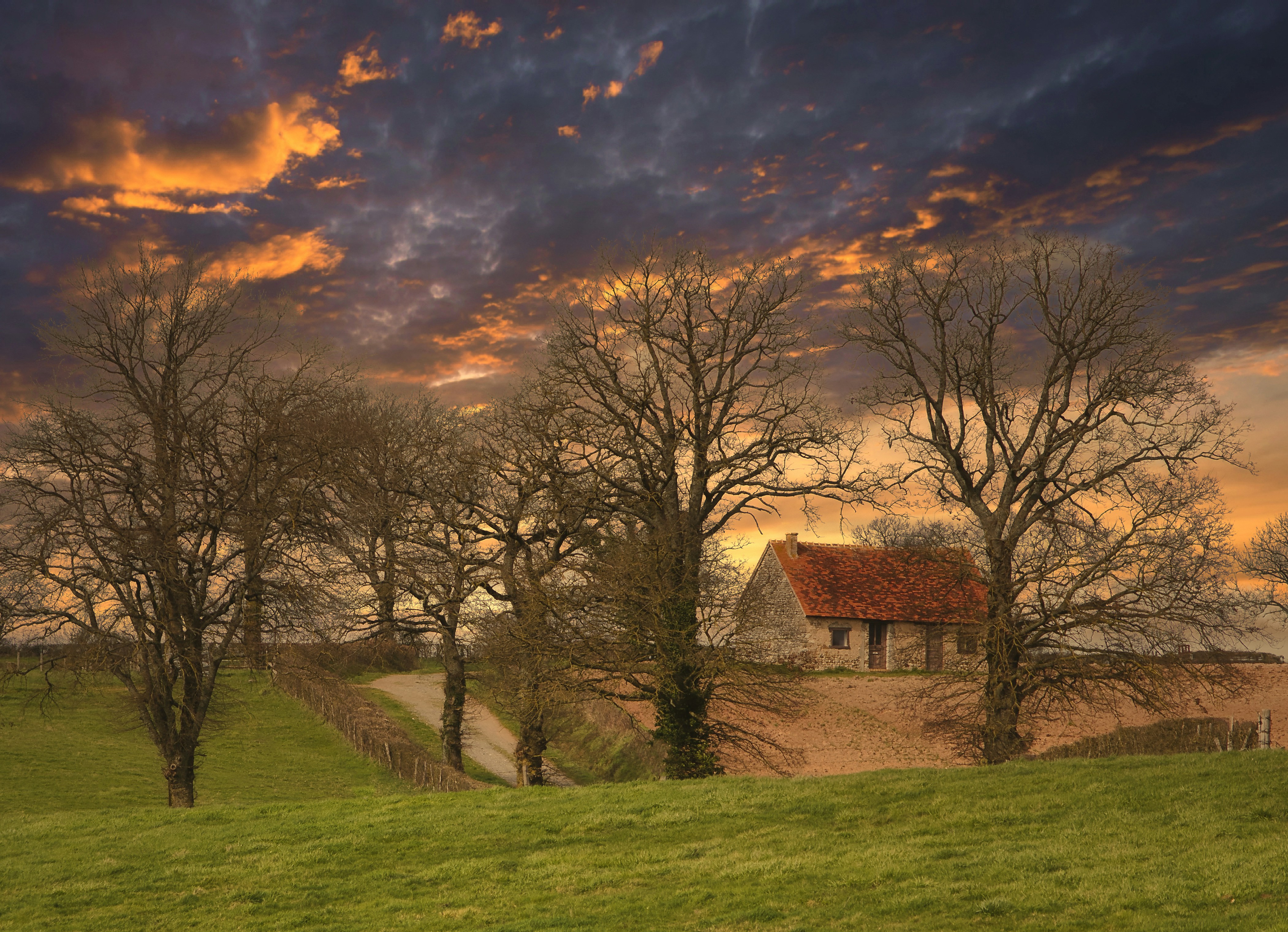 Sunset Farmstead: A Quiet Rural Edge Beneath Fiery Skies