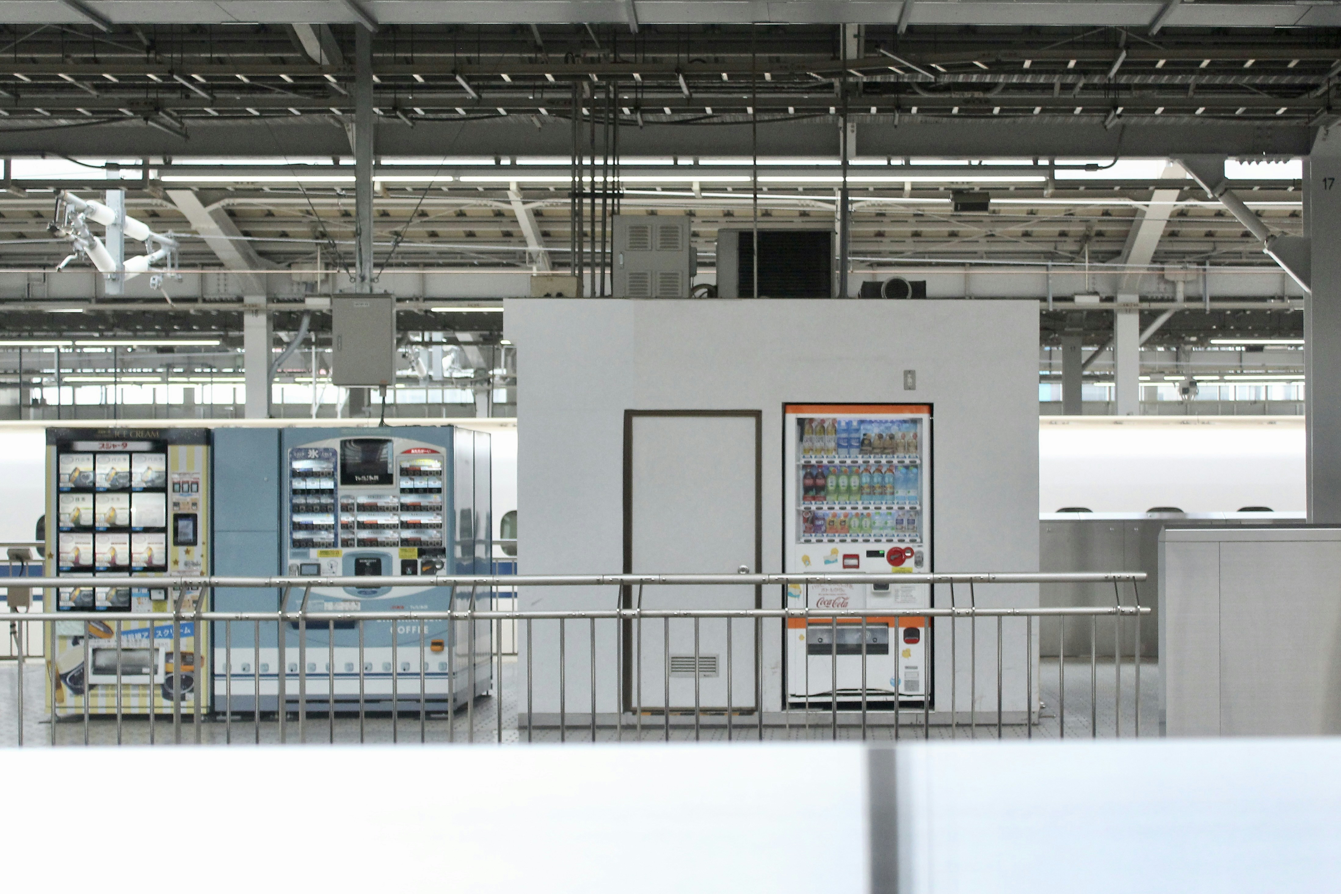 Minimalist Station Vignette: Vending Machines at Quiet Platform