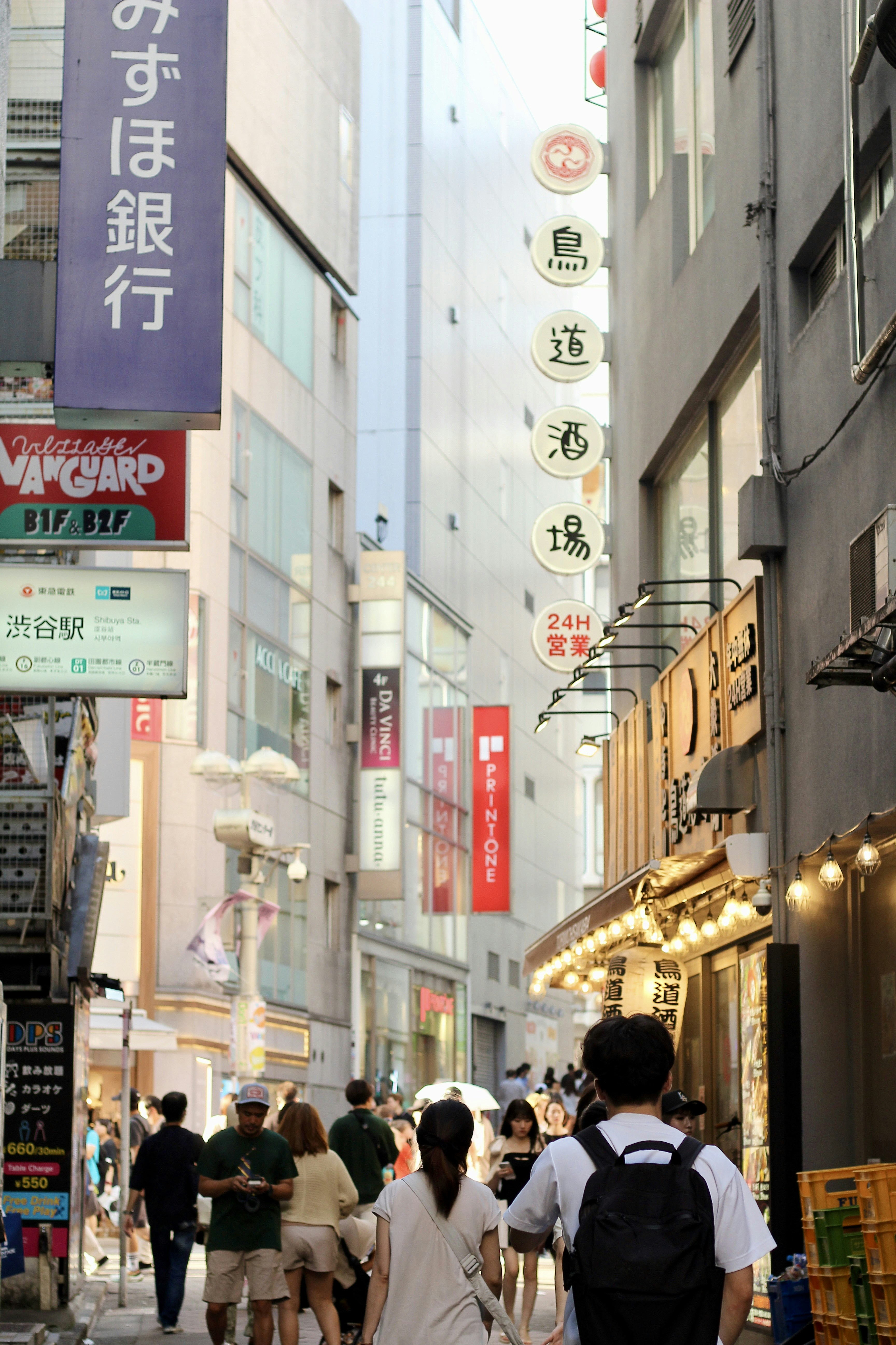 Neon Alley: A Crowded Tokyo Street Embrace