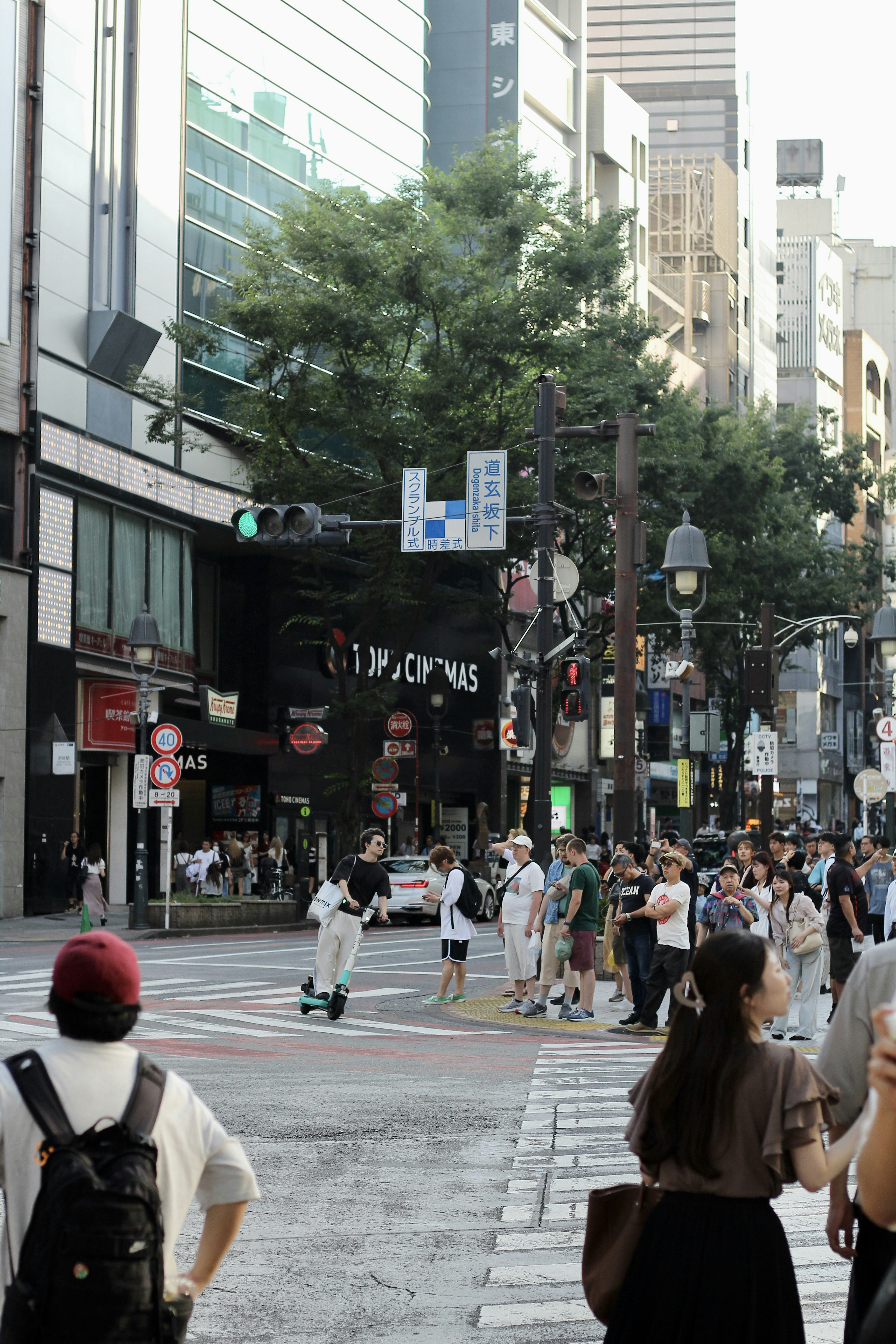 Crosswalk Acrobat on a Bustling City Street