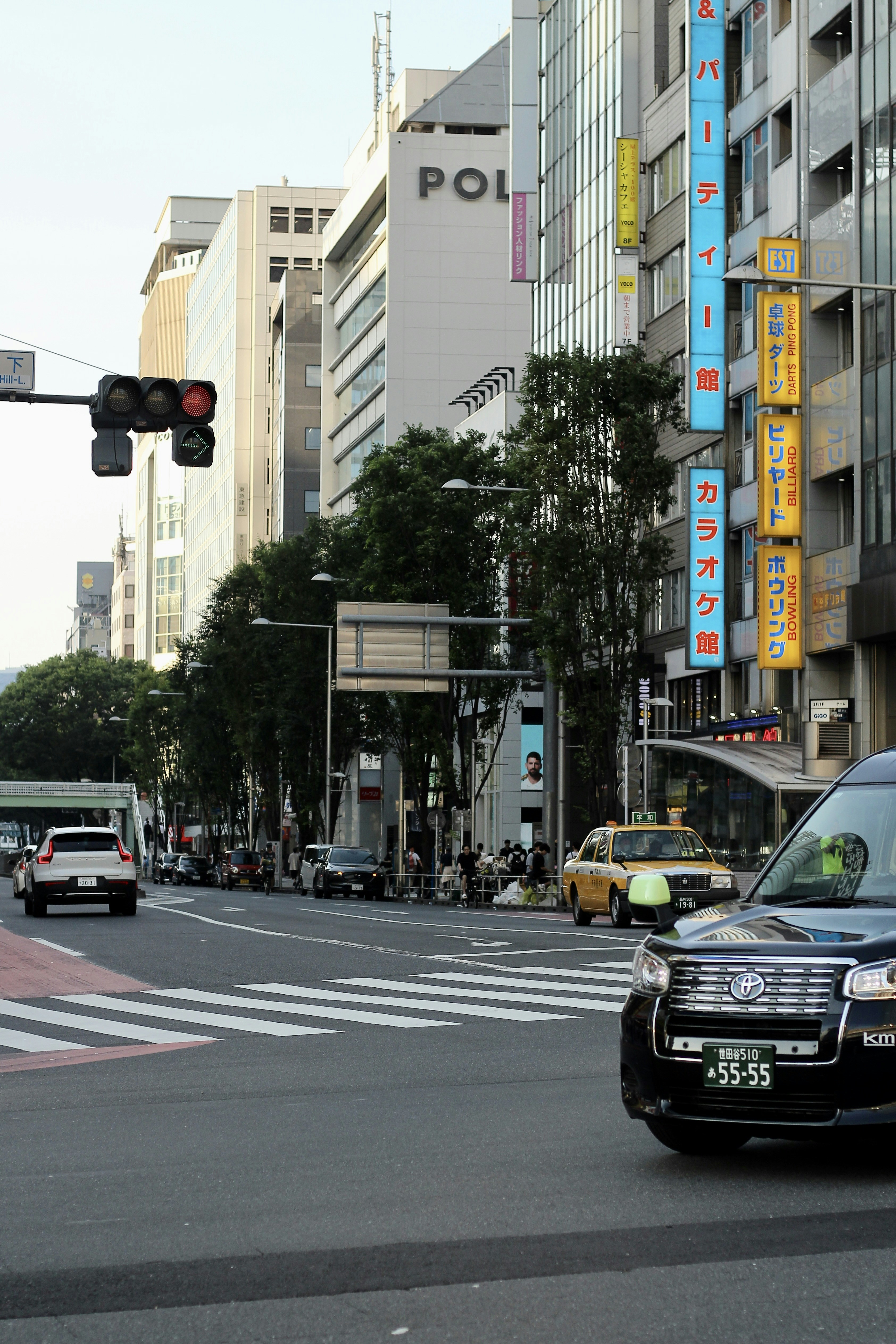 Crosswalk Corridor: City Street, Taxi, and Neon Signage