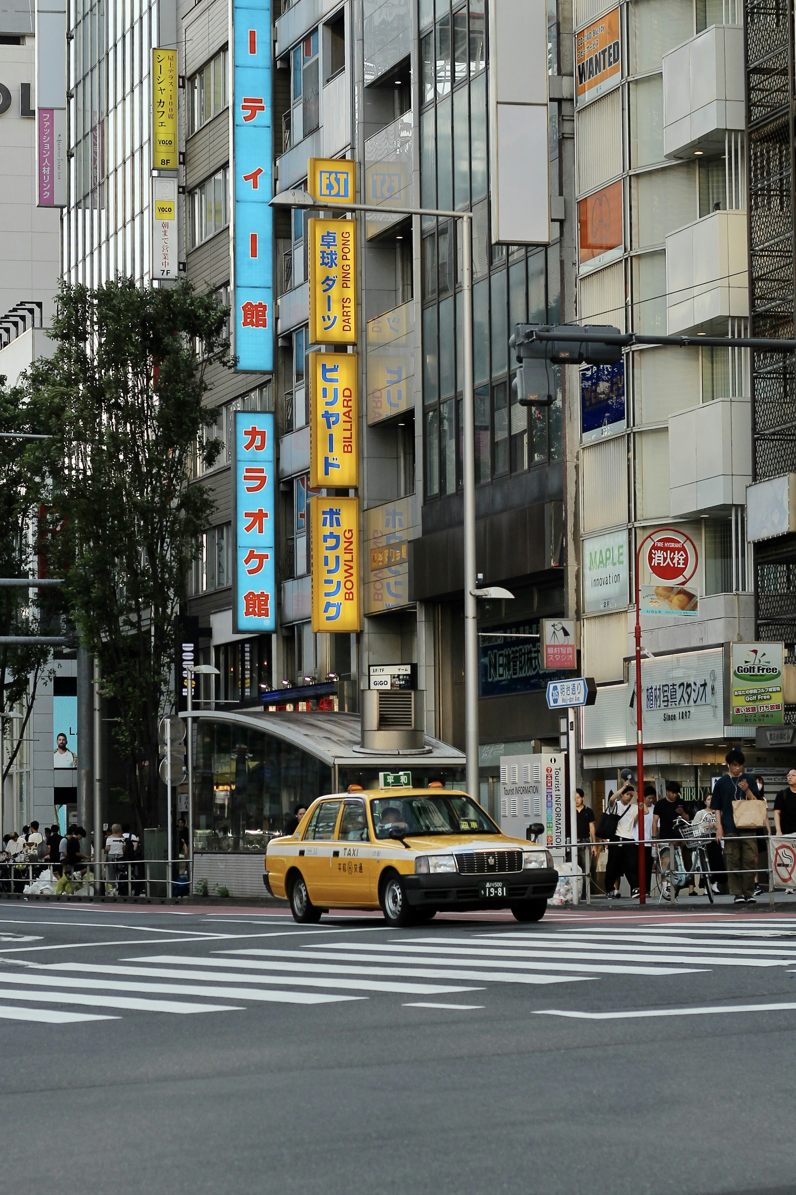 Yellow Taxi at a Neon Midtown Crosswalk