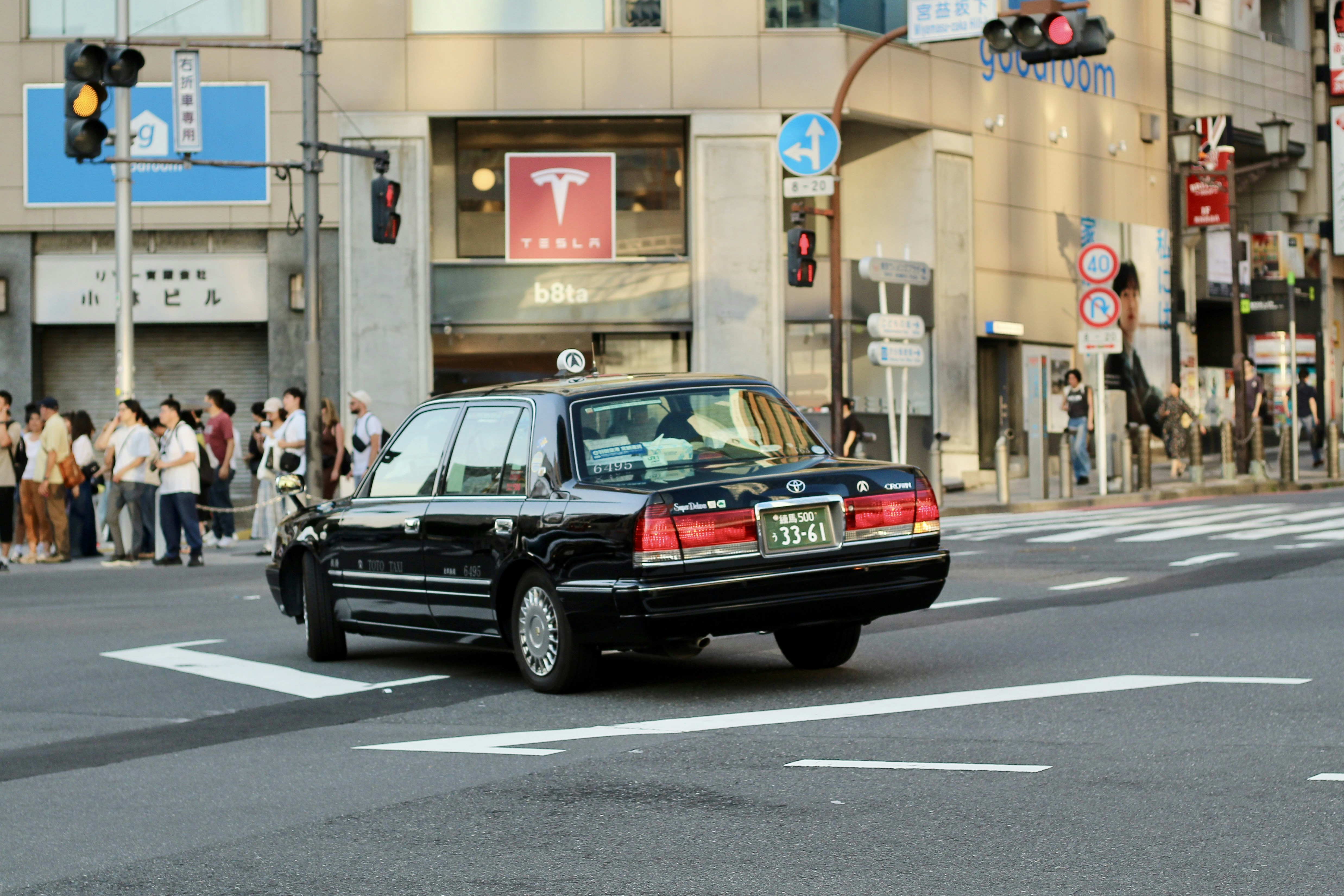 Tokyo Taxi at the Crosswalk: Nightlife in Motion