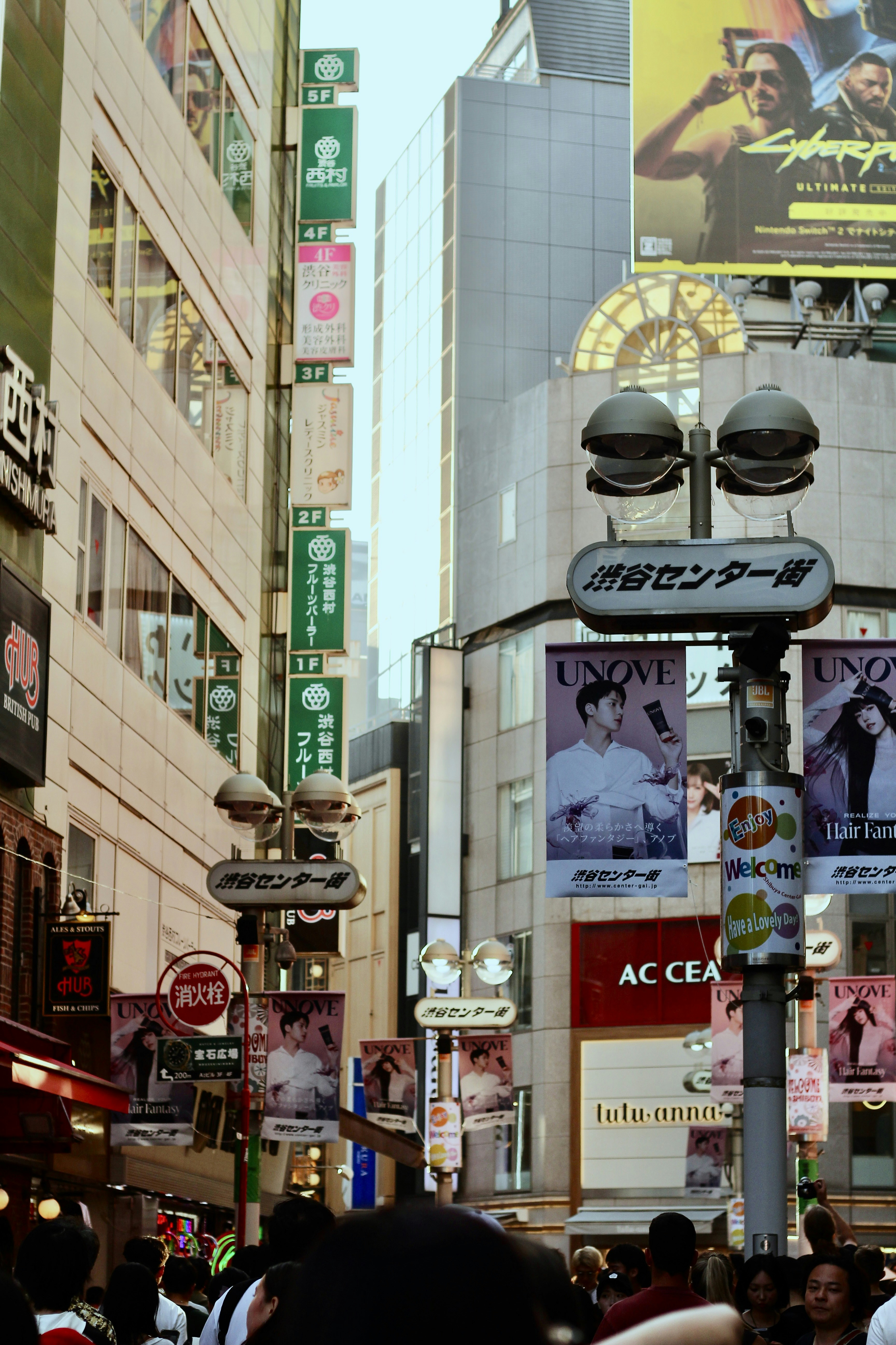 Neon Alleyways: A Bustling Tokyo Crossing Framed by Advertisements
