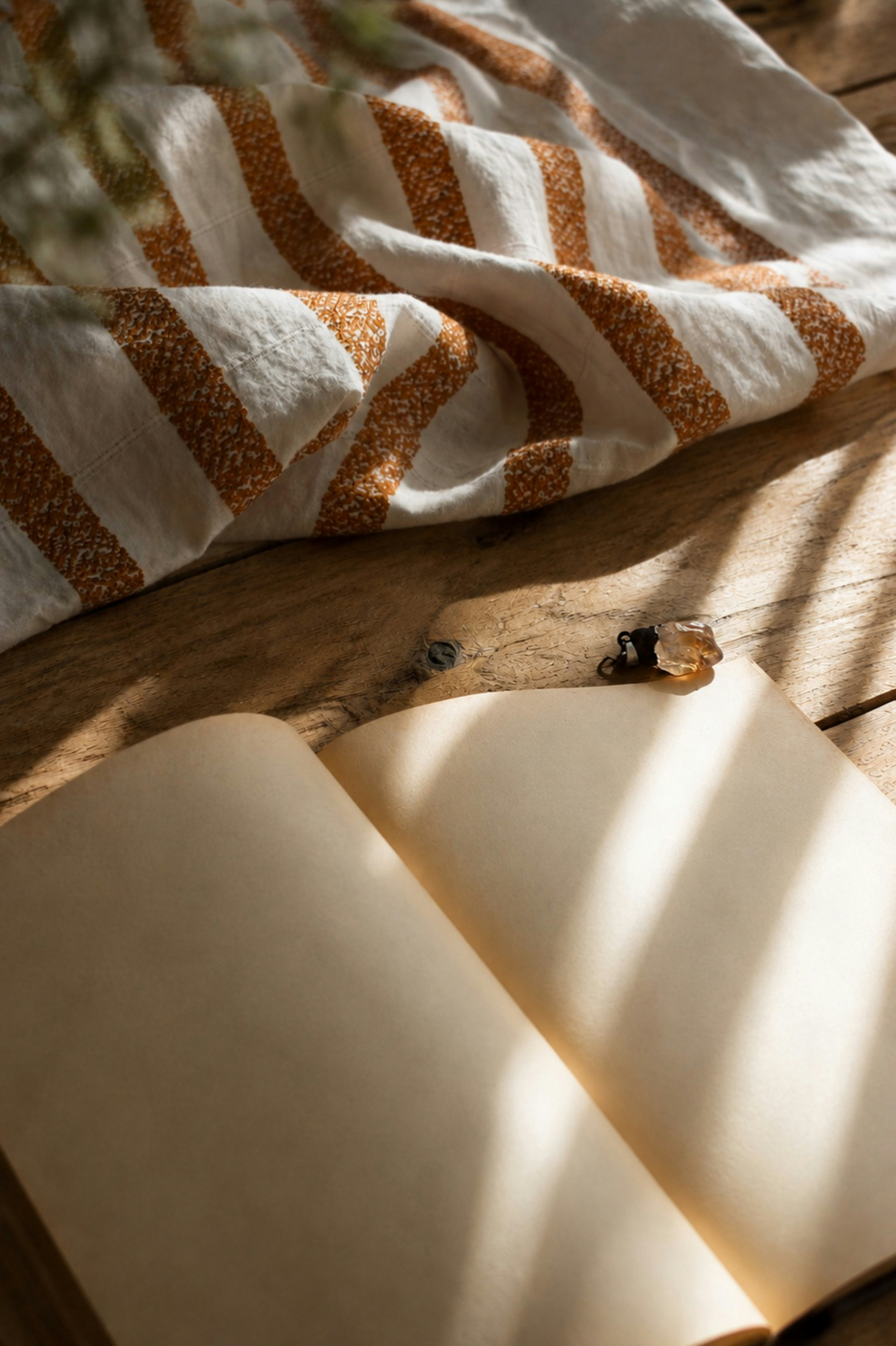 Sunlit Journal: Blank Pages and a Striped Linen Towel