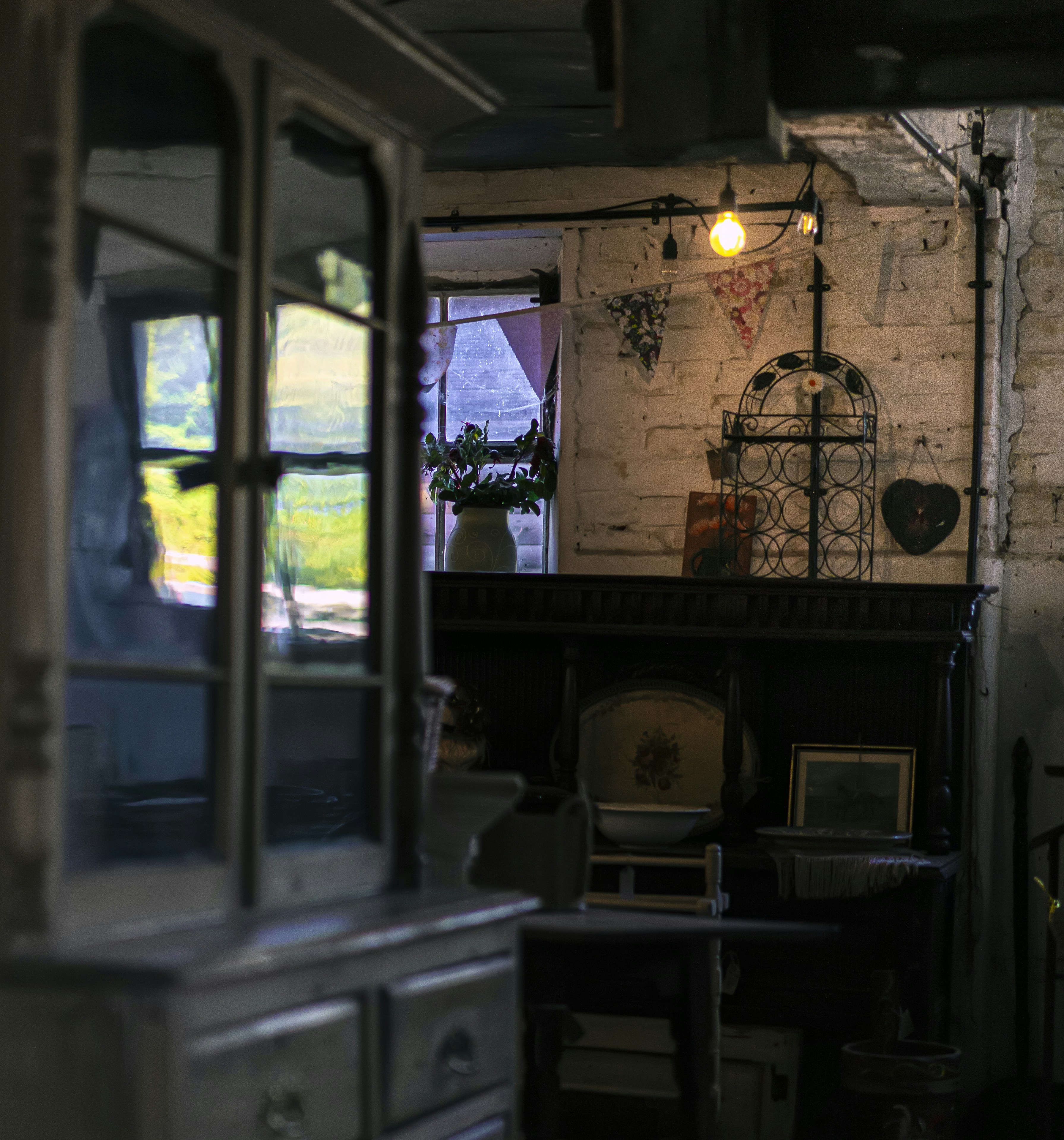 Dusty Corner of a Vintage Shop: Sunlit Window and Rustic Mantel
