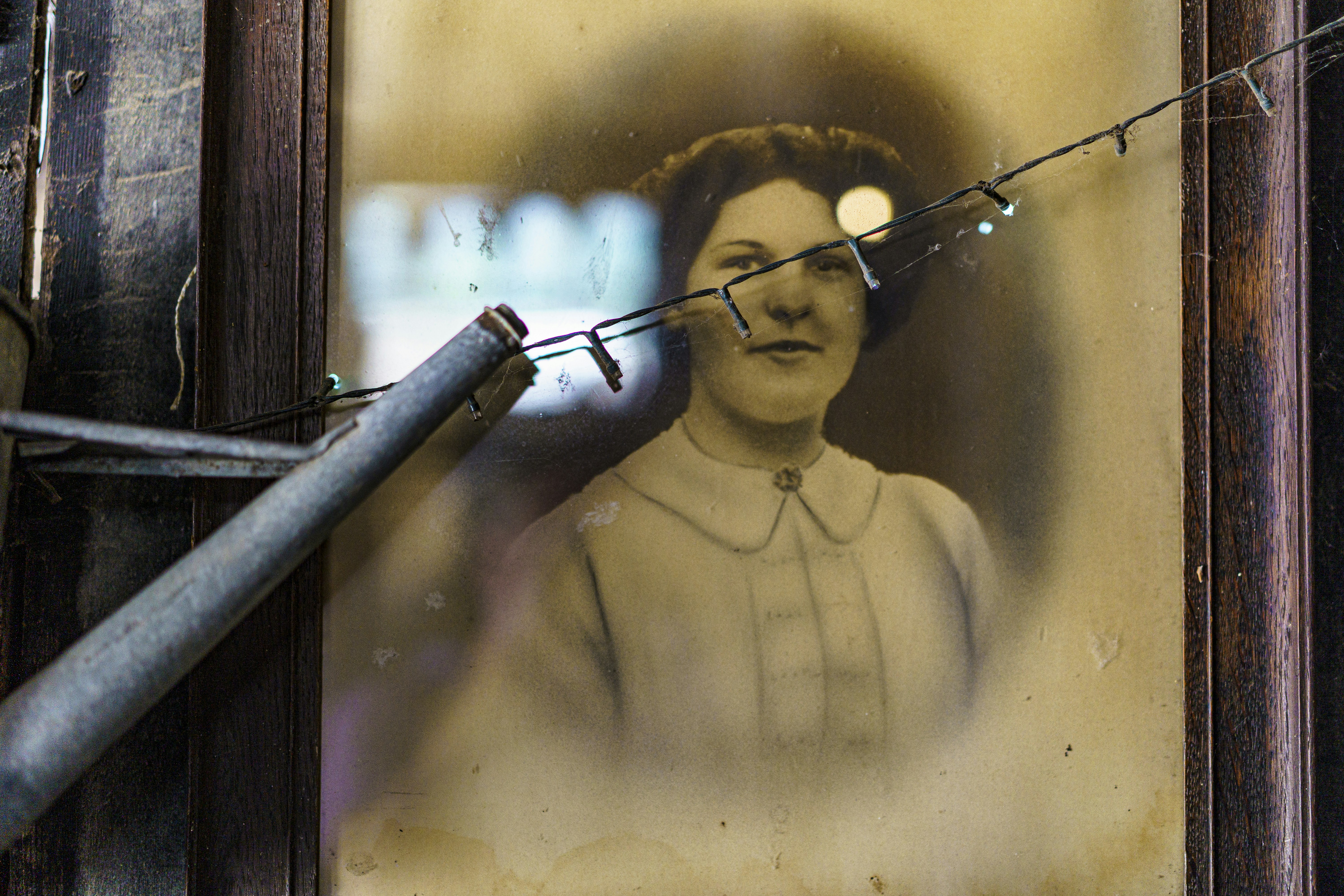 Ghostly Portrait in a Weathered Window