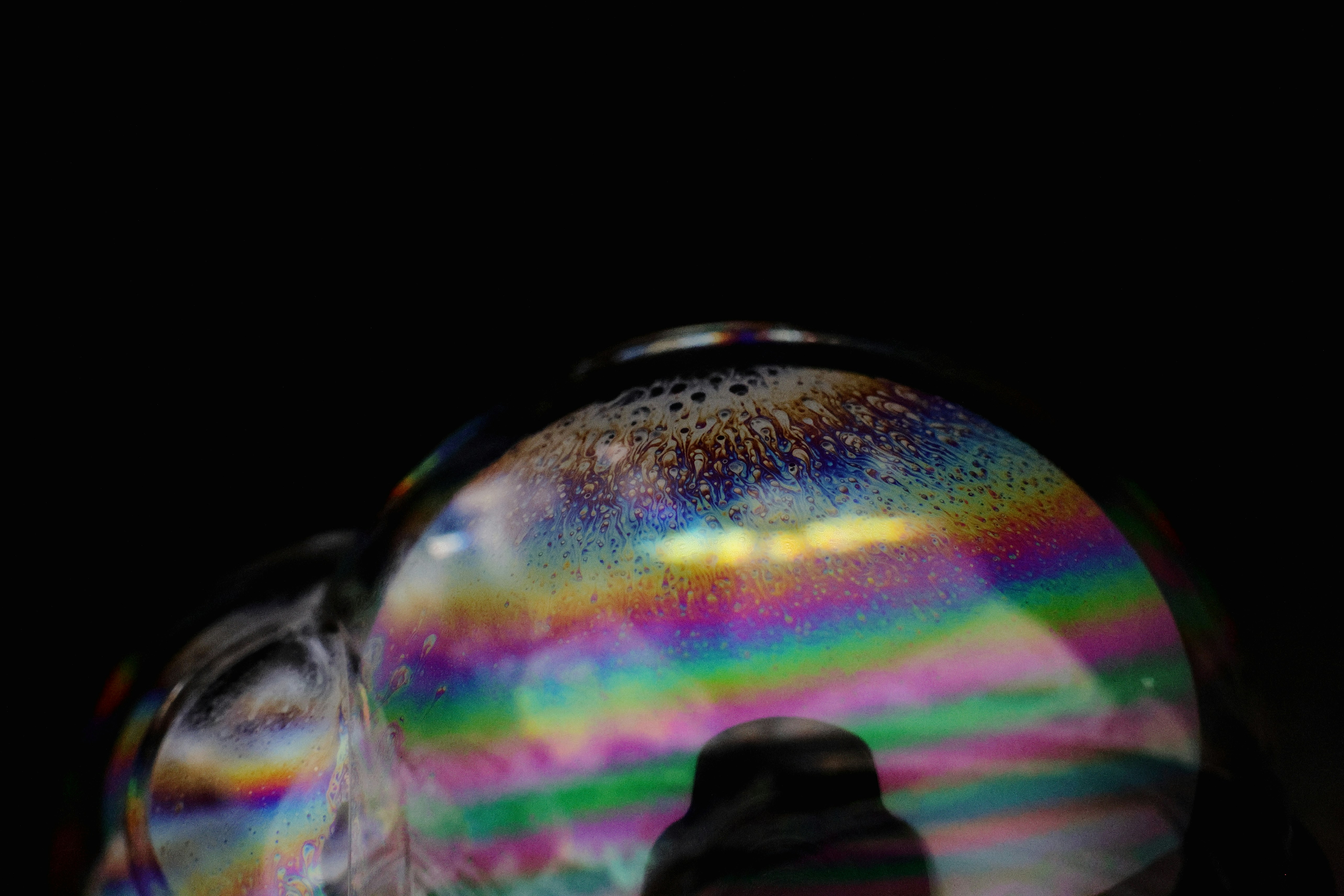 Prismatic Bubble: Colorful Ring Inside a Translucent Orb