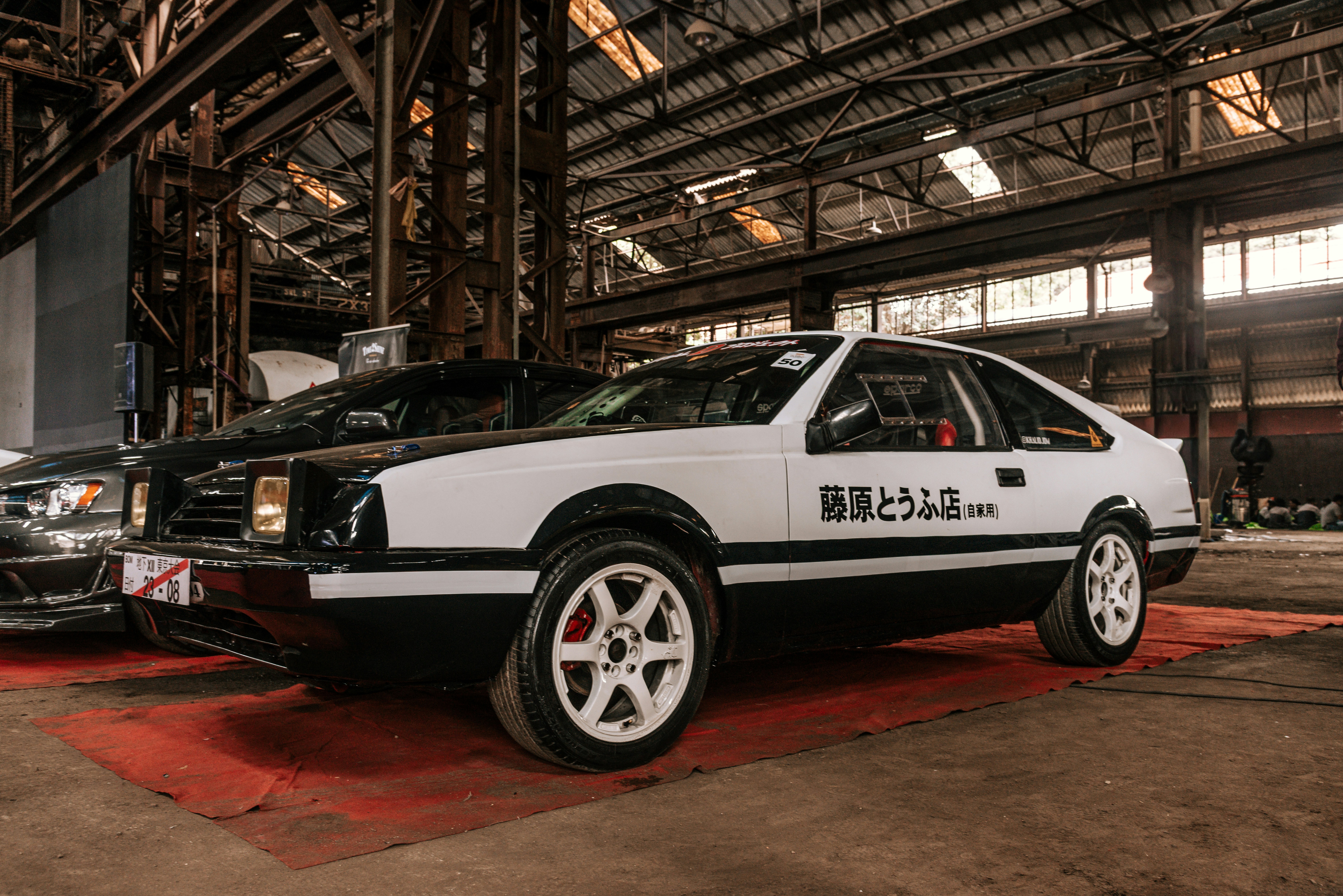 White Toyota AE86 Drift Stance in Industrial Hall