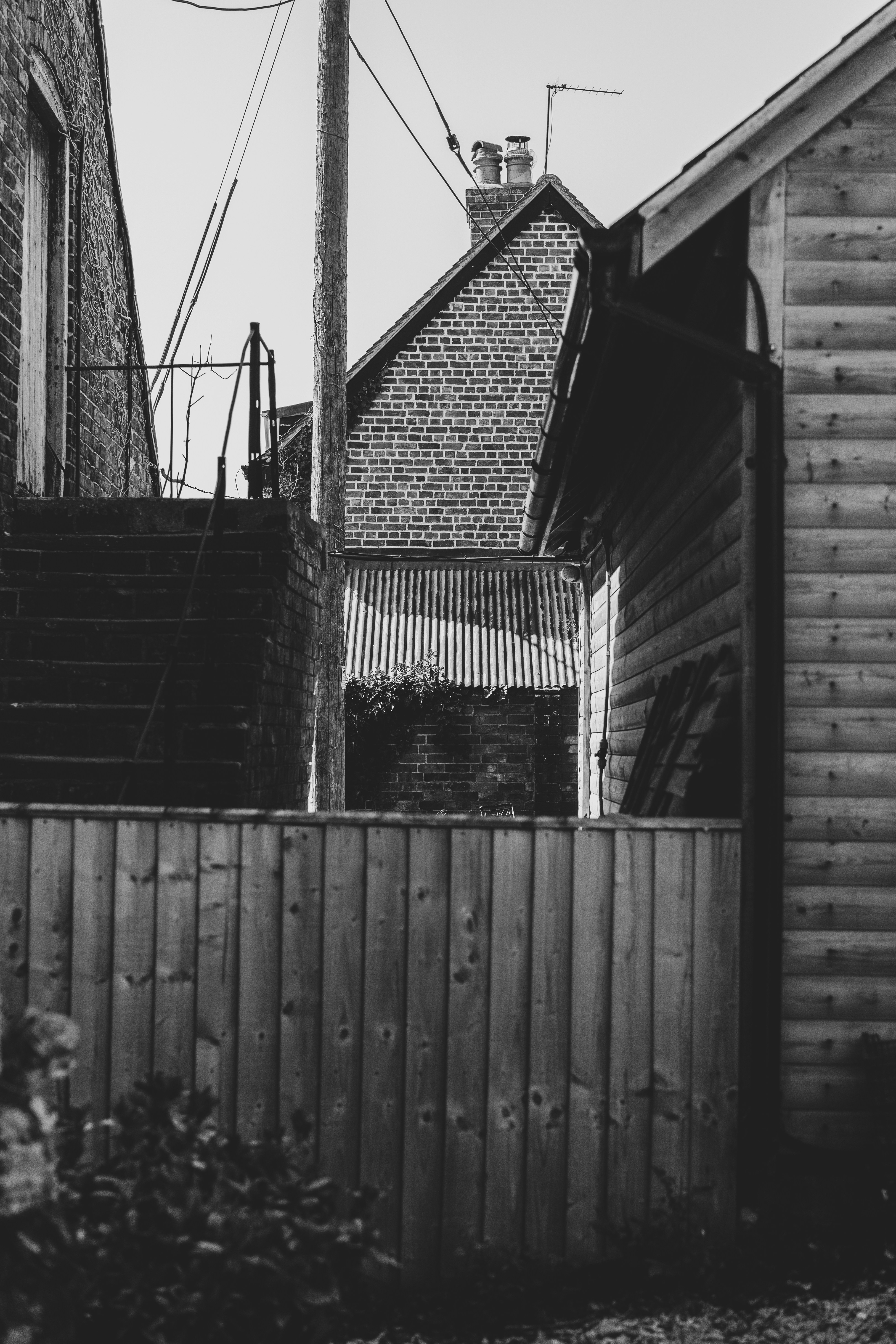 Urban Aegis: Narrow Alleyways Framing a Quiet Stairwell