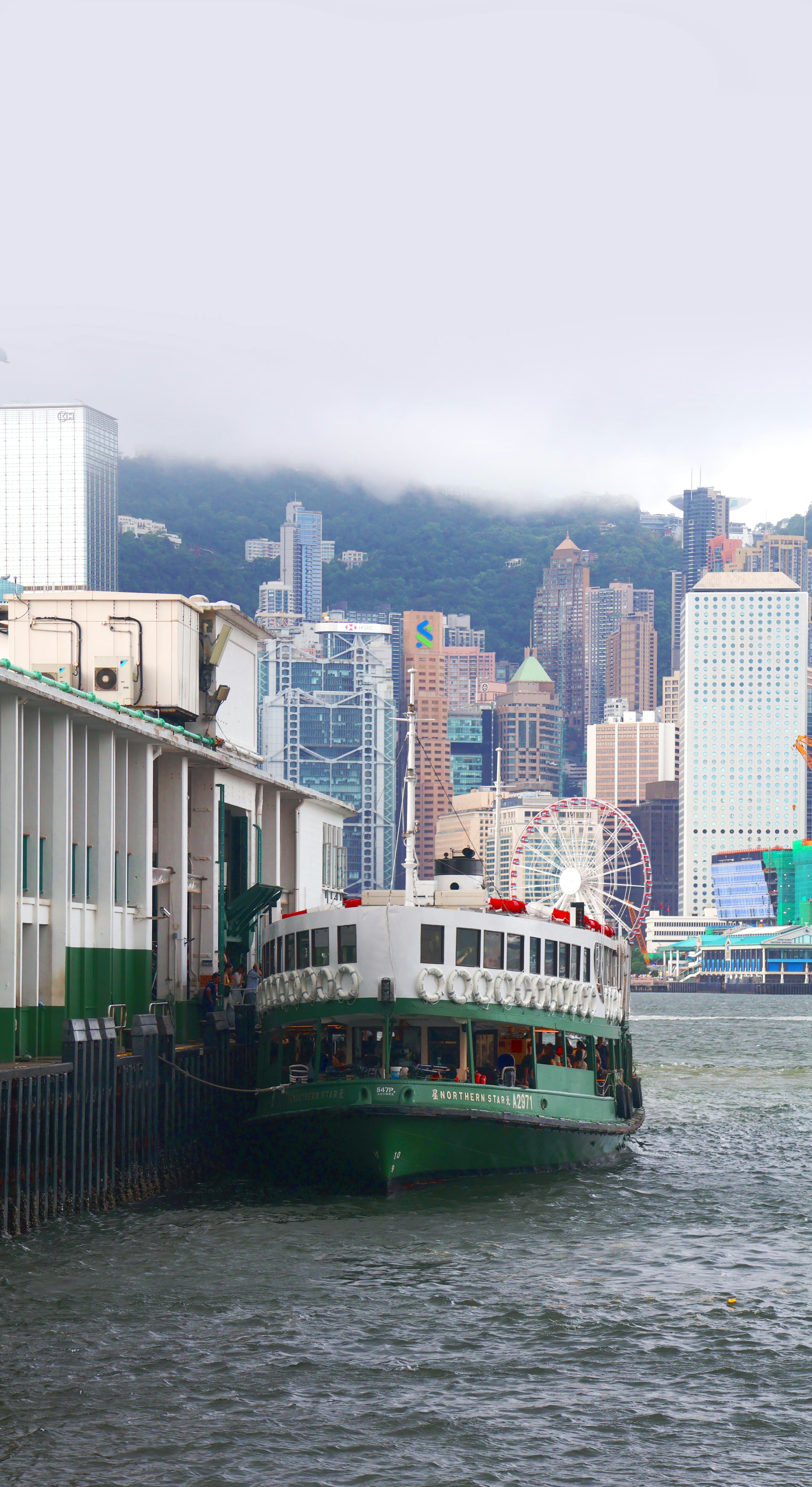 Green Harbor Ferry at the City Skyline