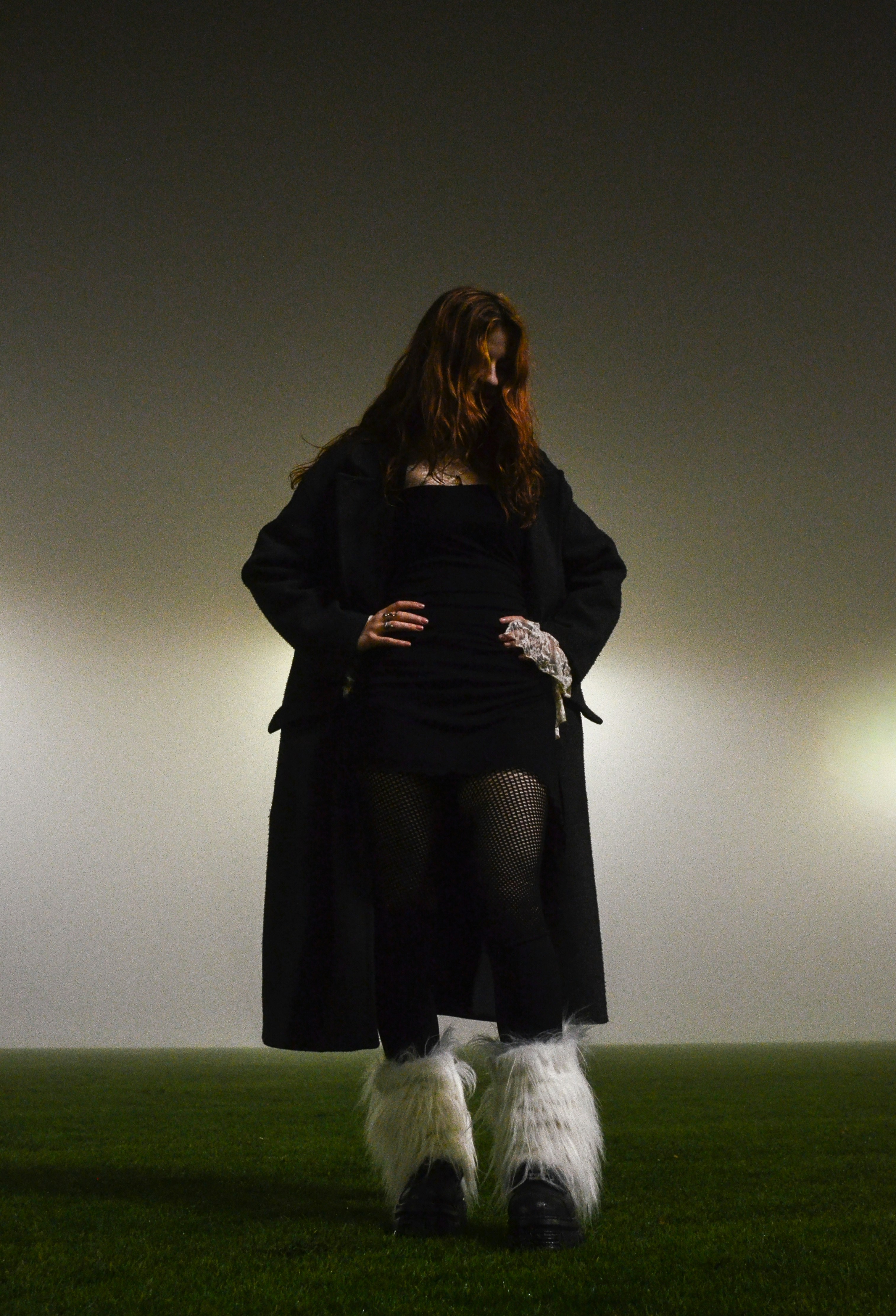 Empress in the Fog: A Figure Cloaked in Nightwear on a Field of Green
