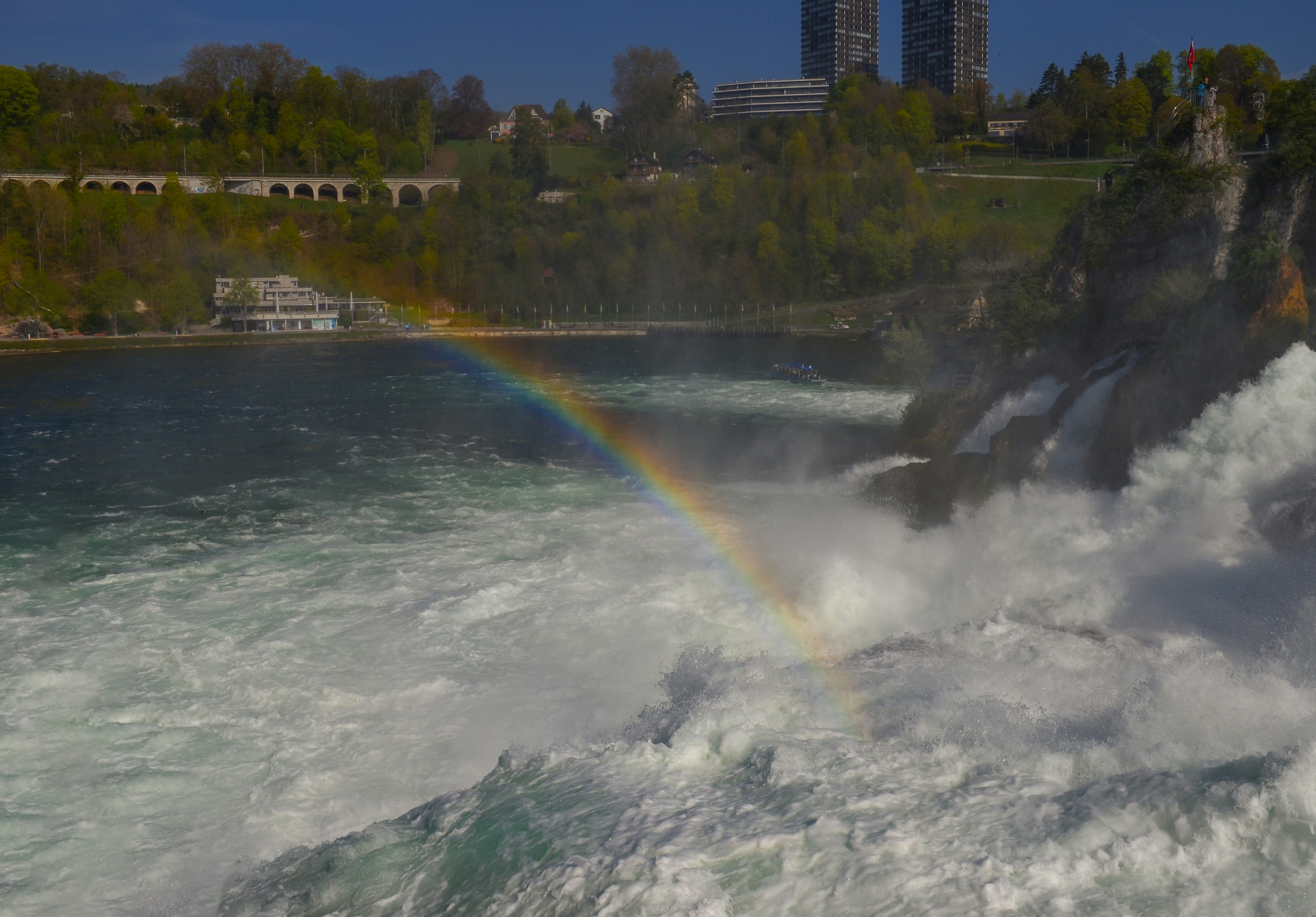 Rainbow Arc over the Roaring Falls: Cityscape and Lower Gorge