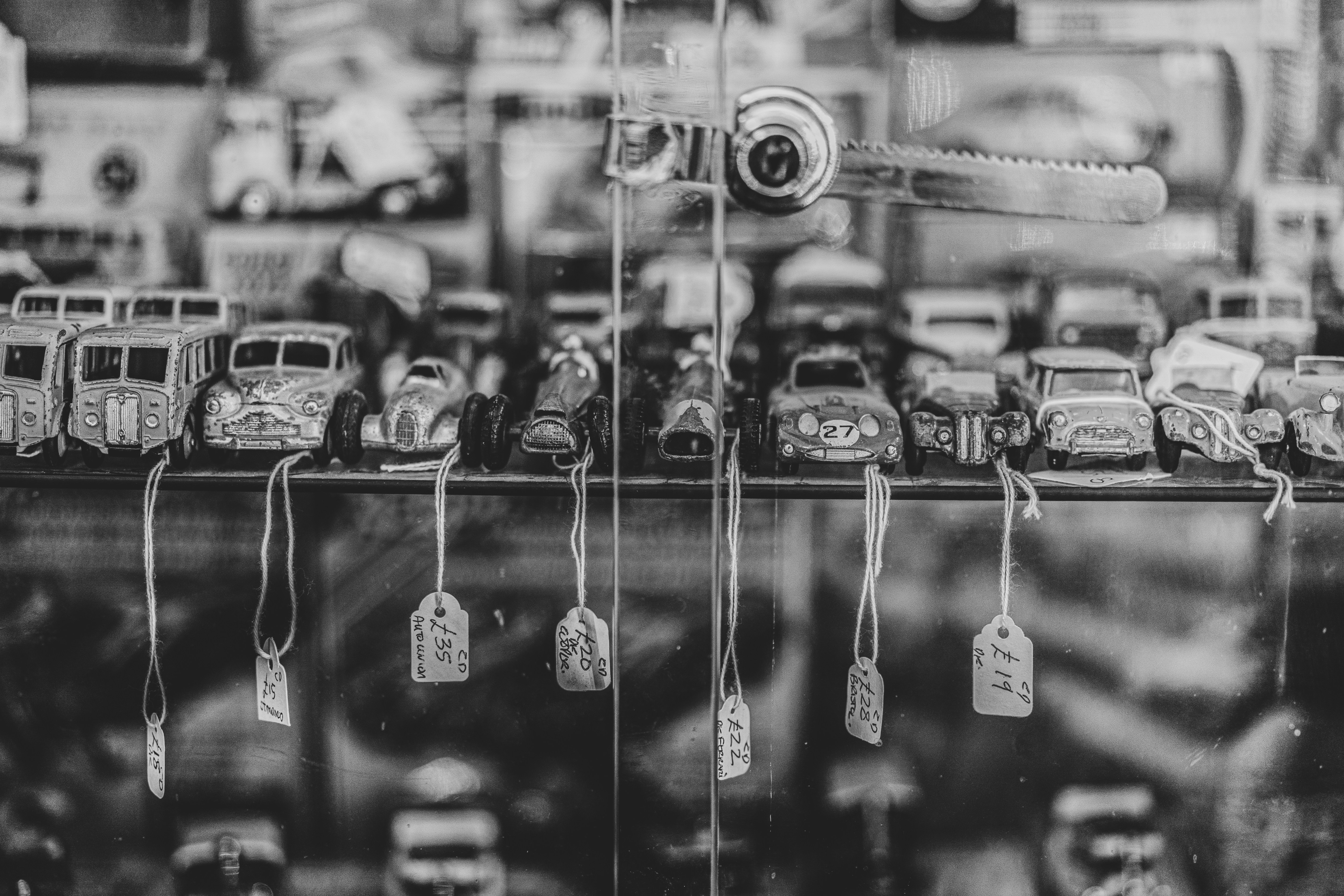 Vintage Display: Tiny Tagged Cars and a Clockwork Wisp