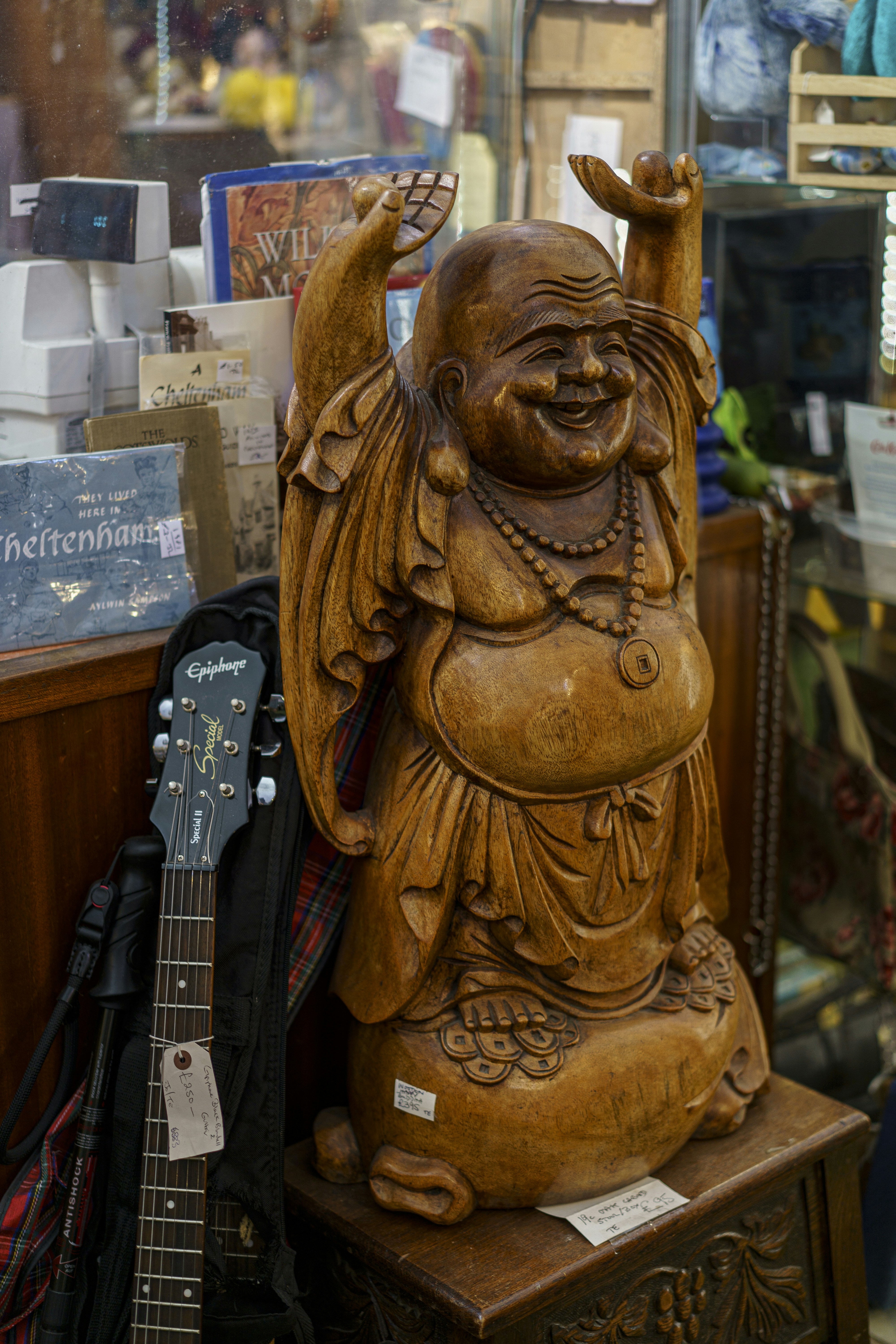 Laughing Buddha Guarding a Workshop of Strings and Shelves