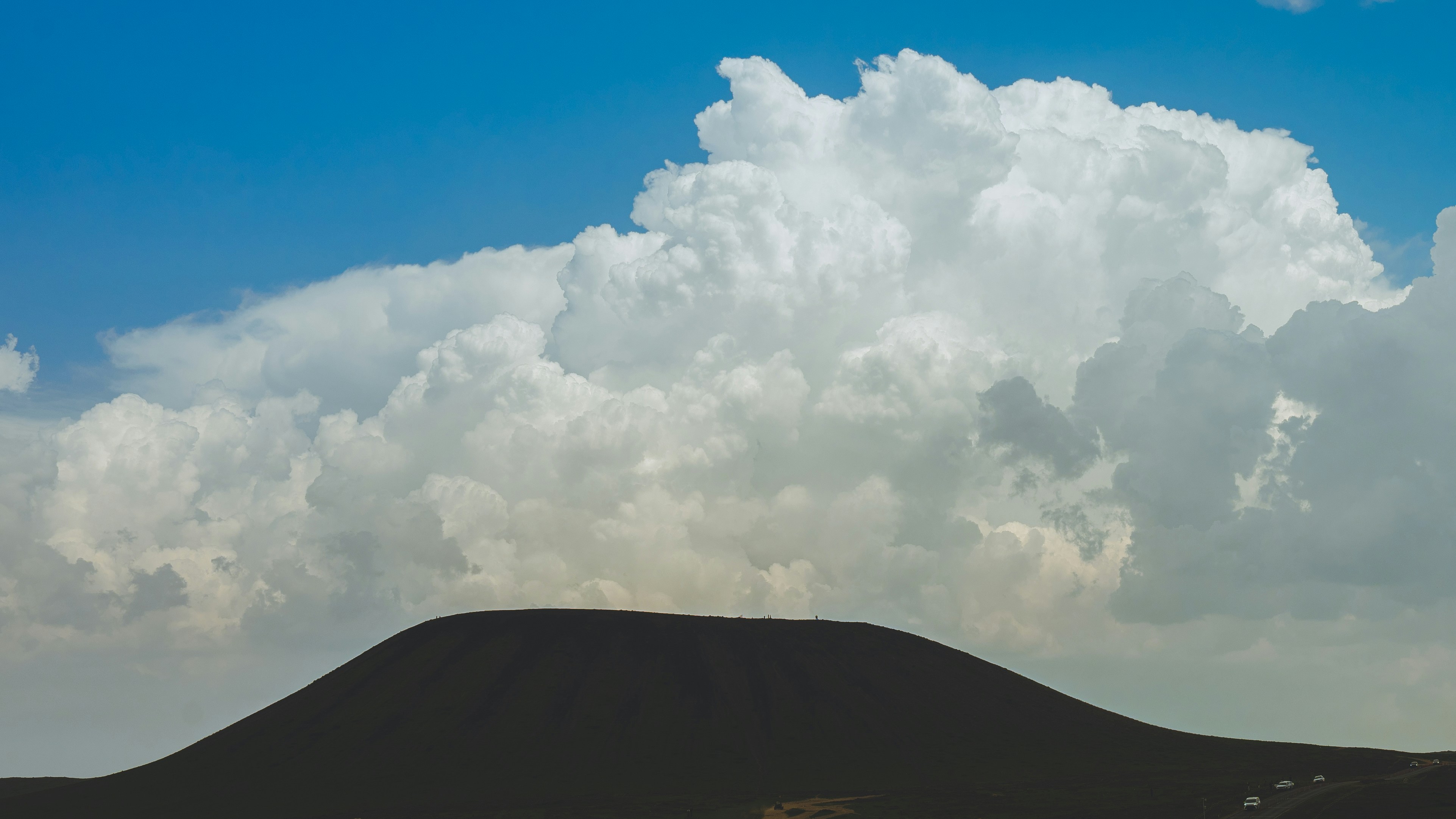Silhouette of a Gentle Dune Under Expansive Sky