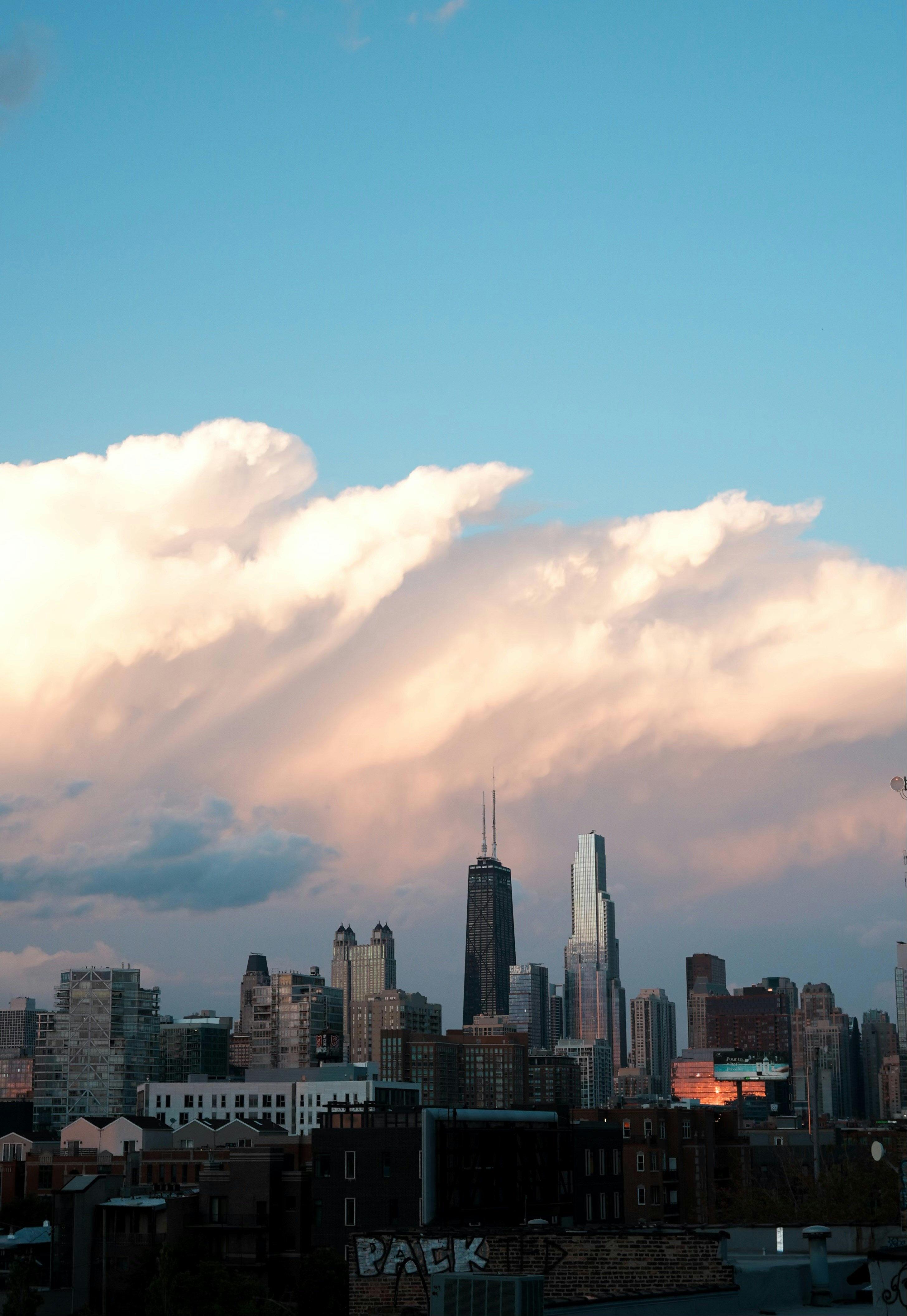 City Portrait Beneath a Sky of Peachy Clouds