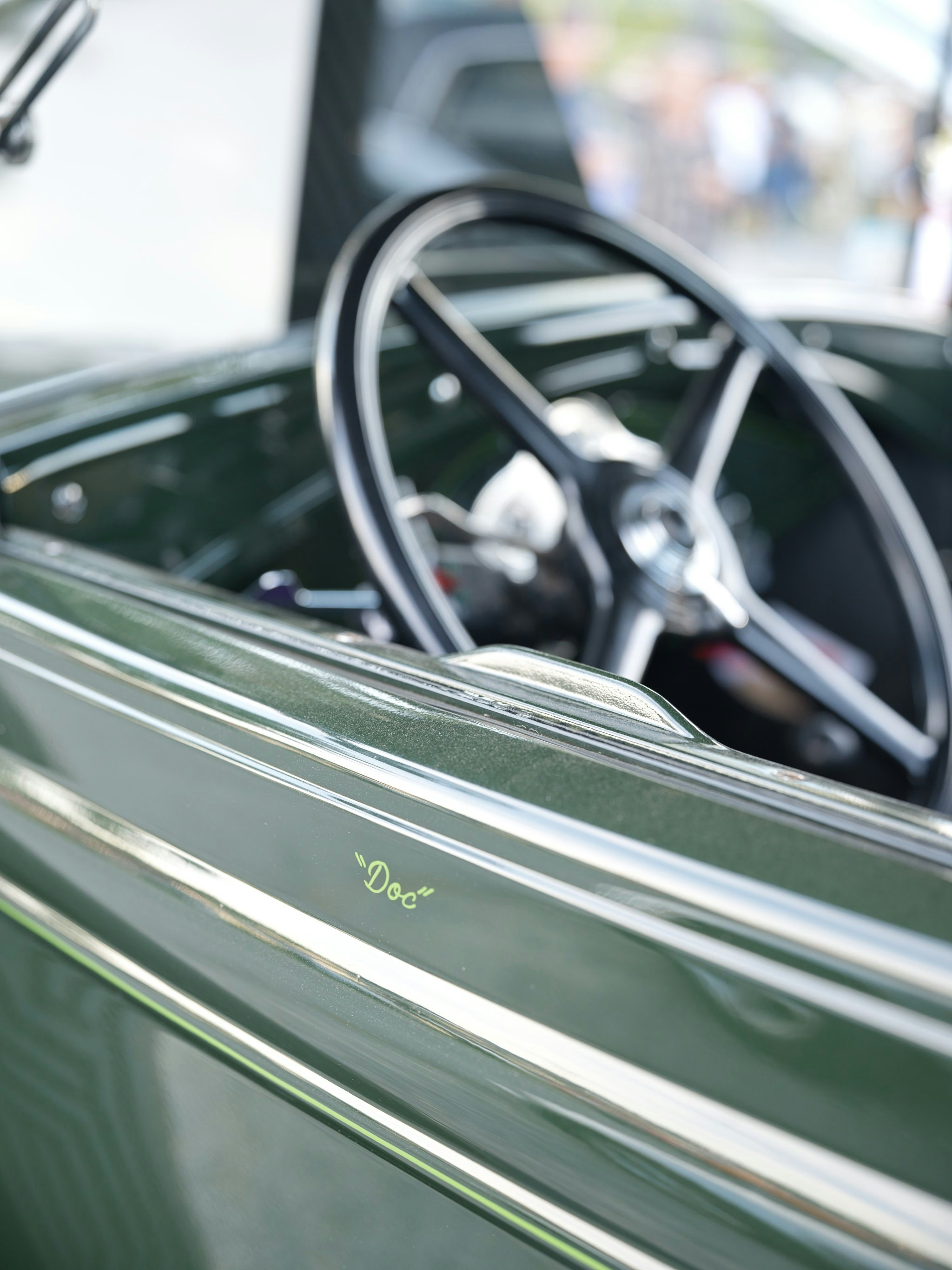 Chrome Trim and Glassy Green: A Glimpse Inside a Classic Convertible