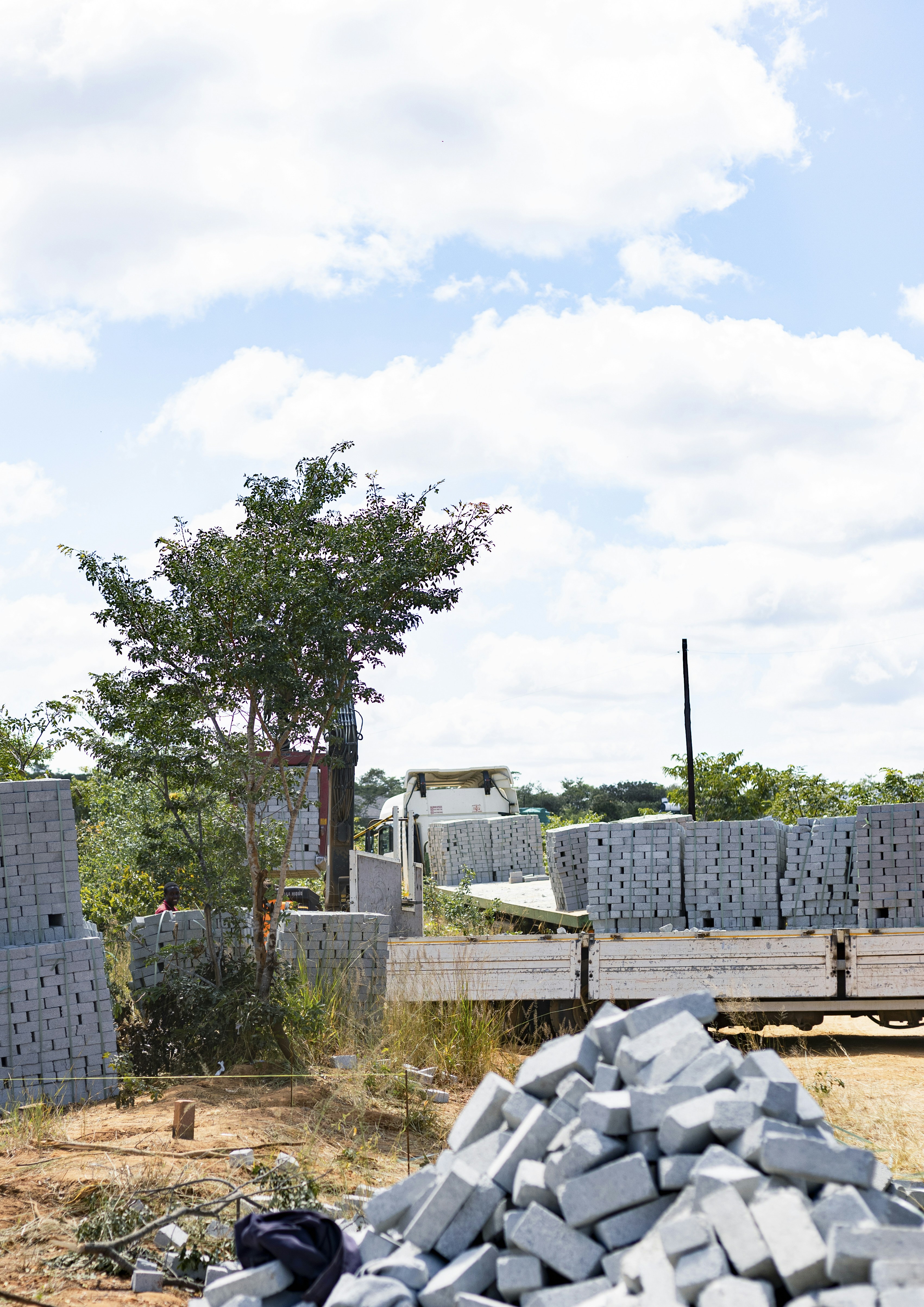 Construction Yard Beneath a Sky of Soft Clouds