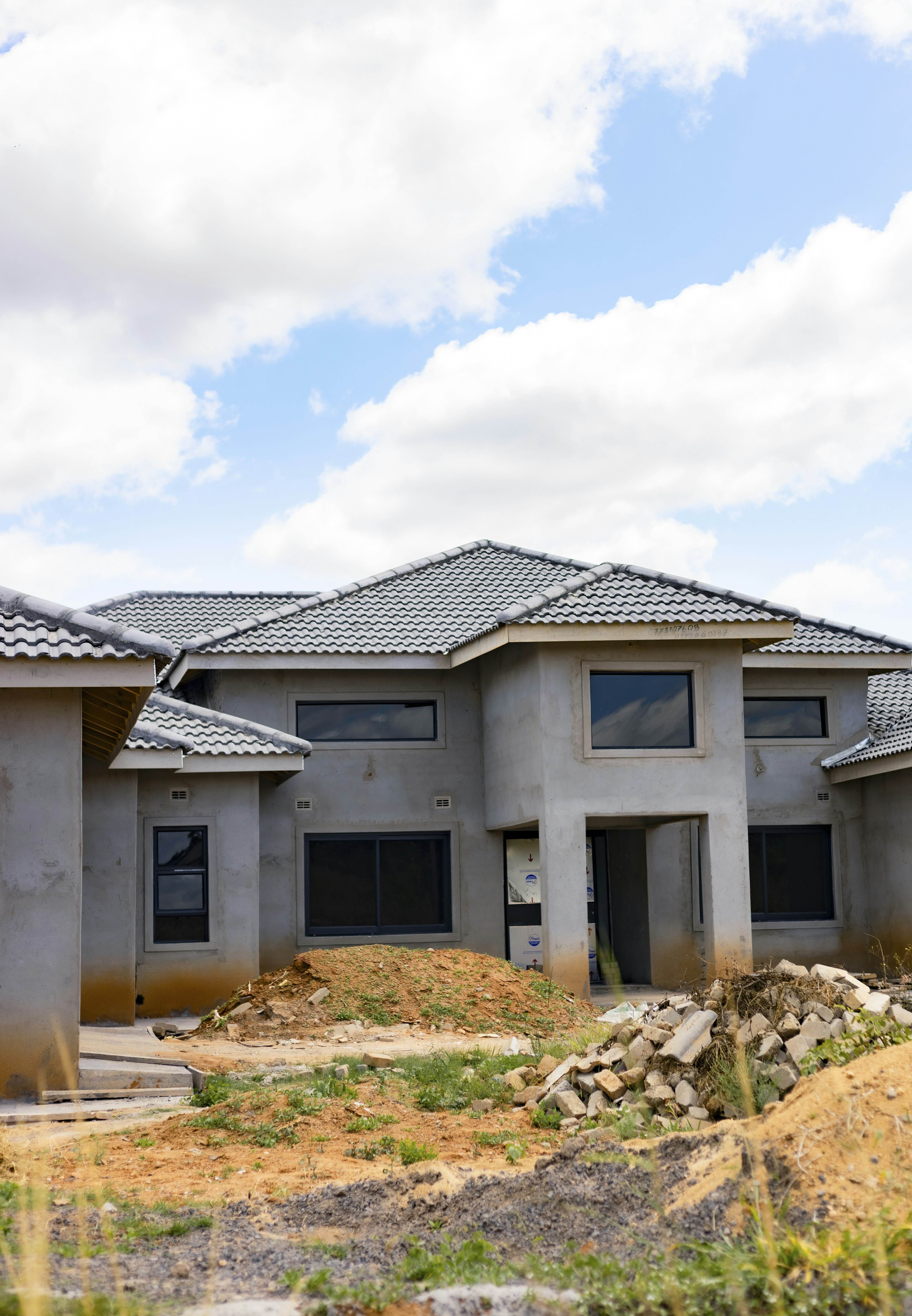 Under Construction: Modern Villa Rising from Earth and Sky