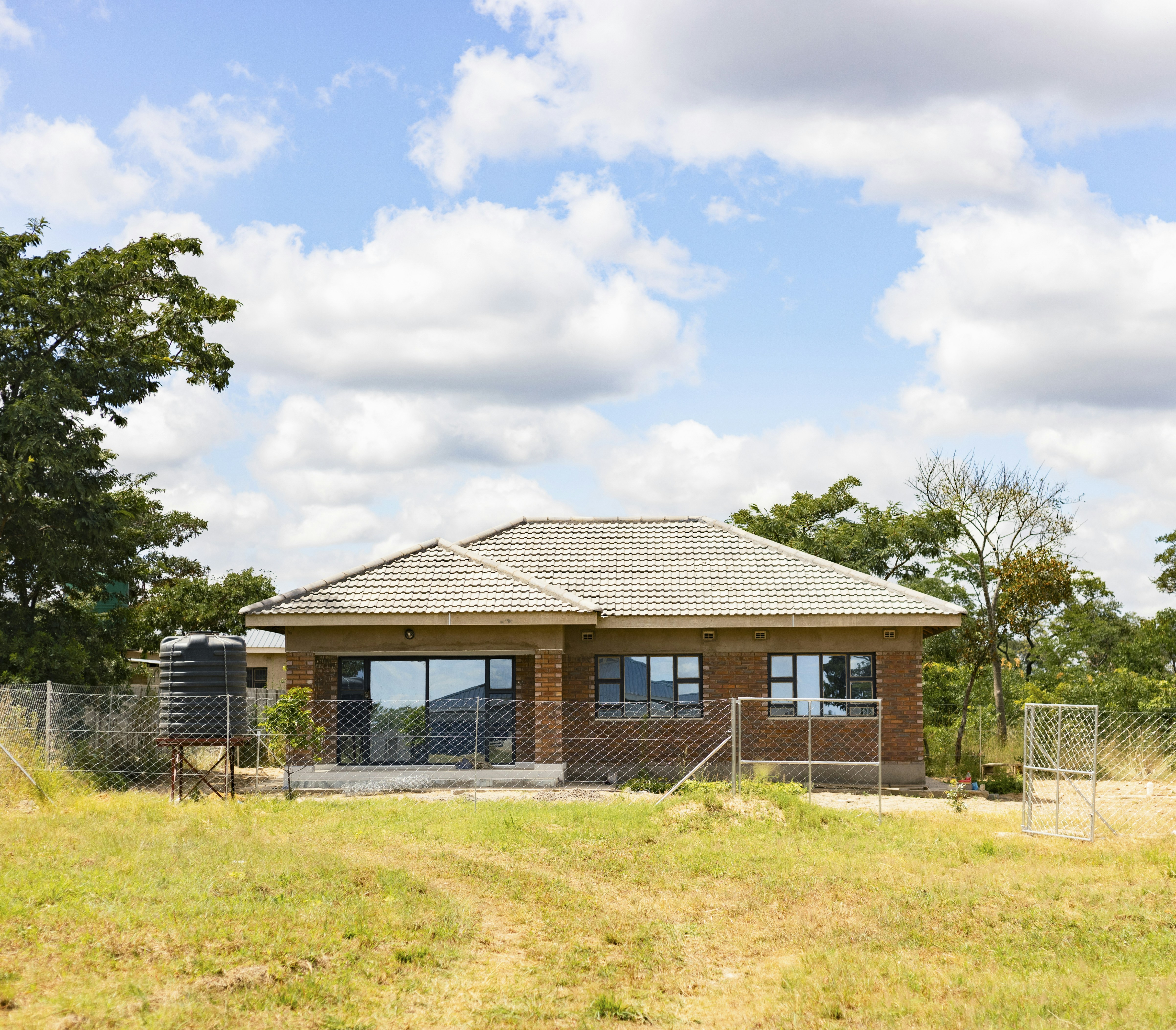 Brick Ranch Under Wide Sky