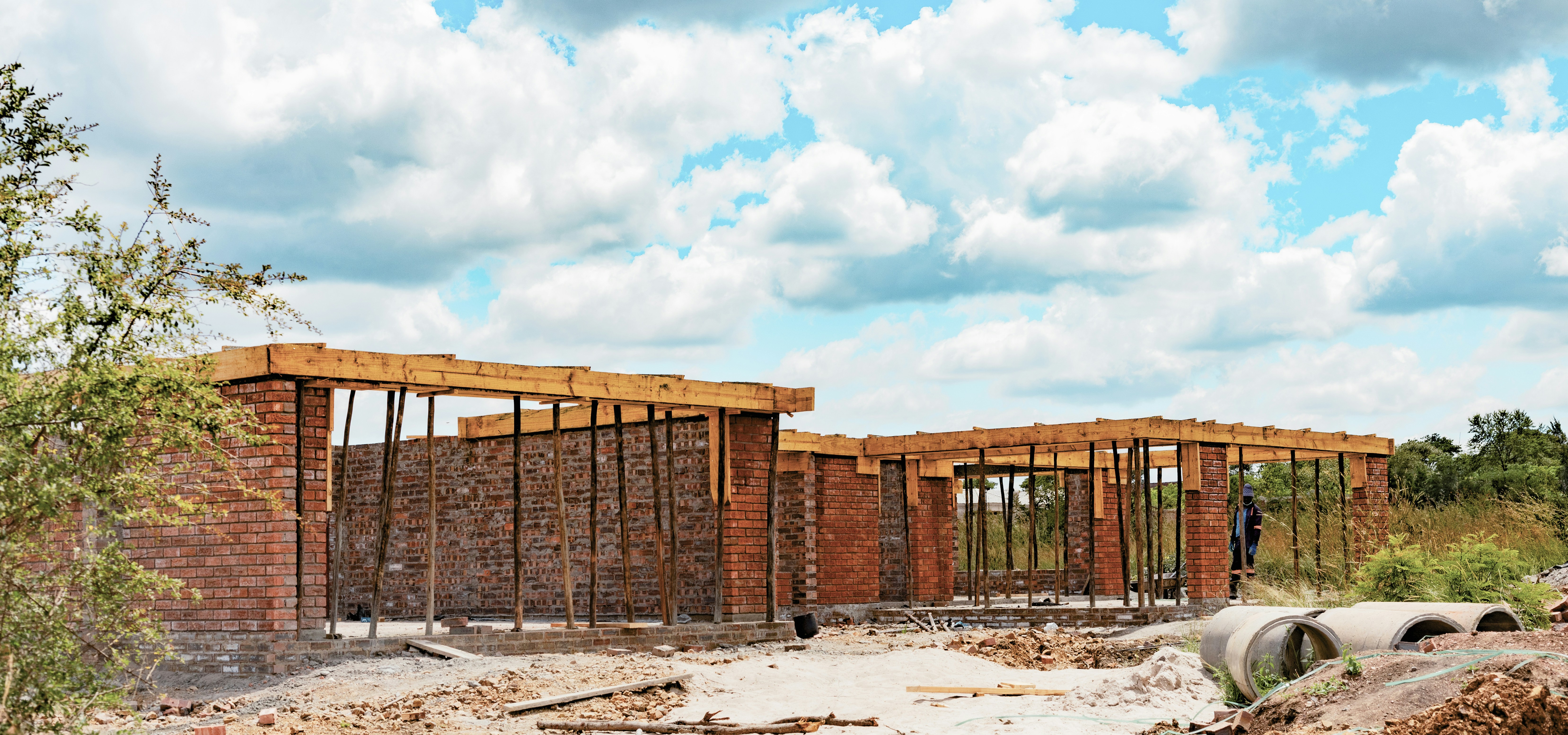 Brick Atrium Rising: A Construction Row on a Sunny Day